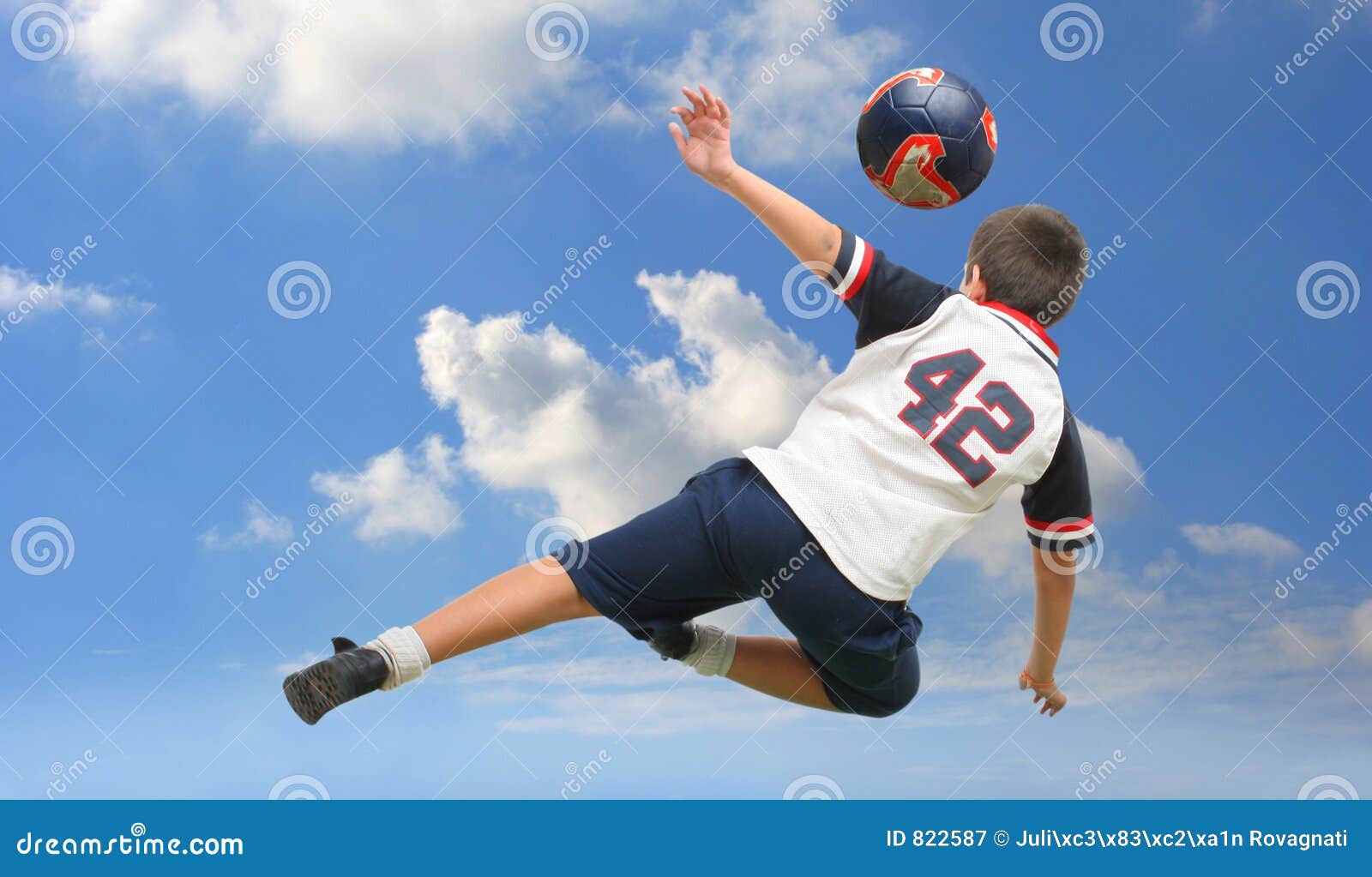Kid playing soccer outside stock image. Image of boots - 822587