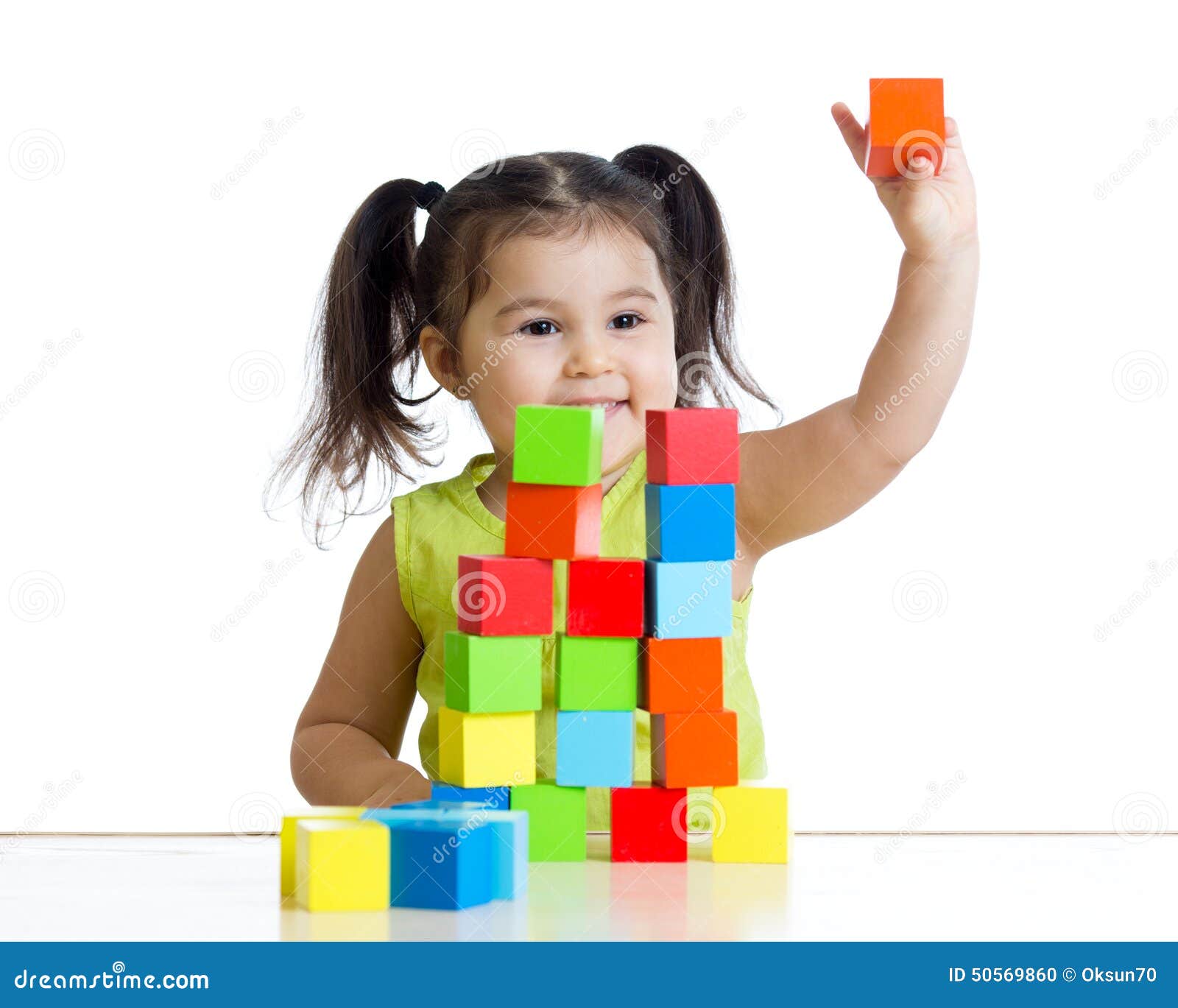 Kid Plays with Building Blocks and Shows Red Cube Stock Photo - Image ...