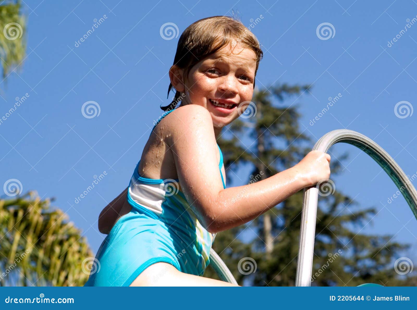 Kid on the Pool Slide stock photo. Image of adorable, backyard - 2205644