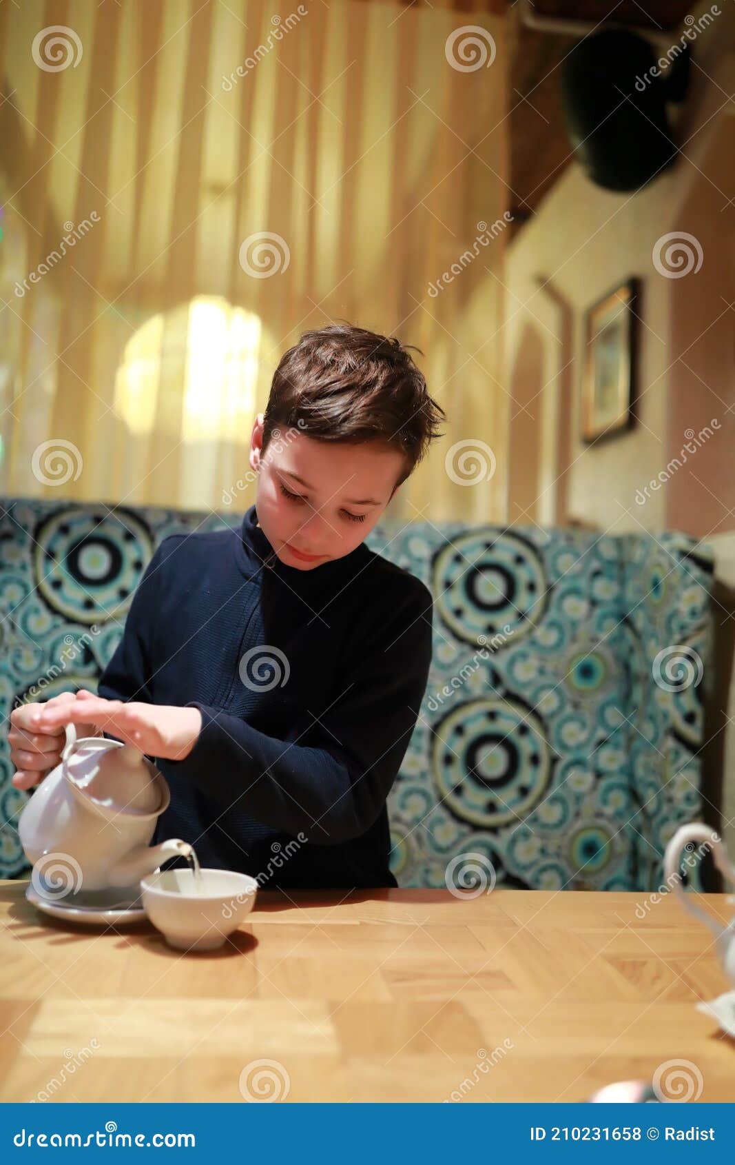 Kid Pouring Tea in Restaurant Stock Photo - Image of cute, indoor ...