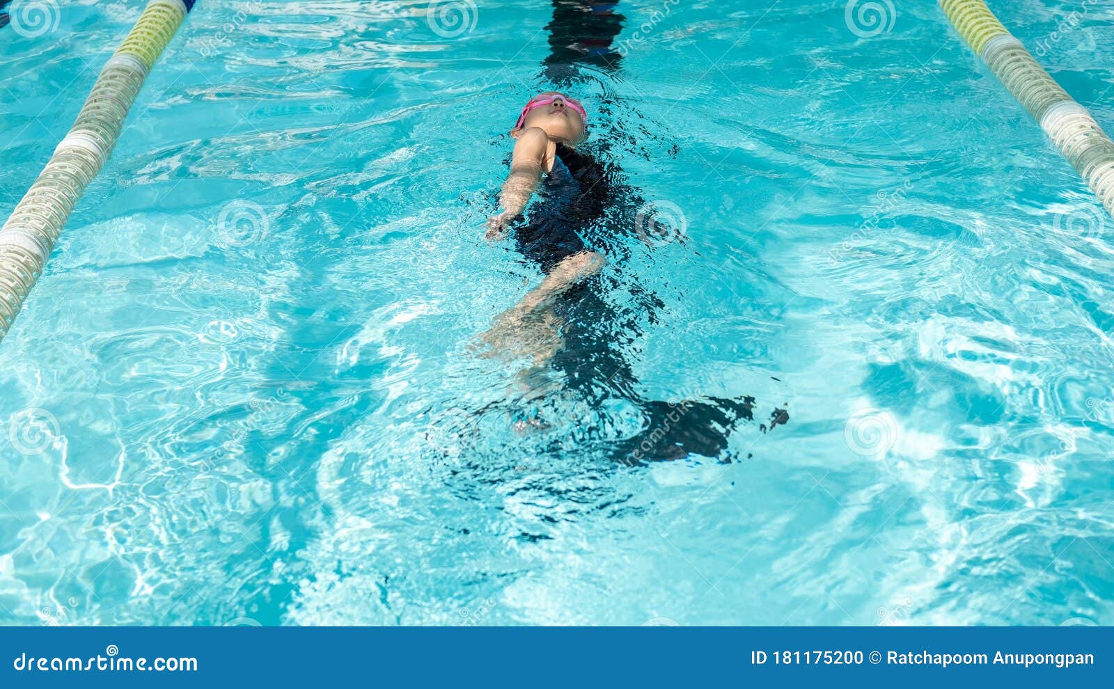 Kid Practice To Swim Backstroke in Swimming Class in the Swimming Pool ...