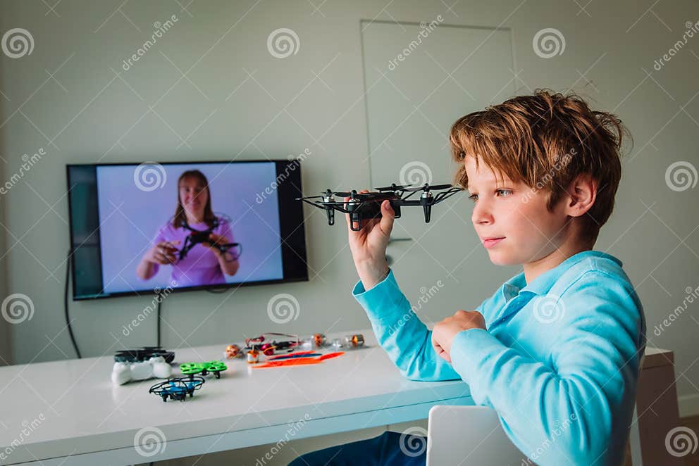 Kid programming drones stock photo. Image of technology - 186358820