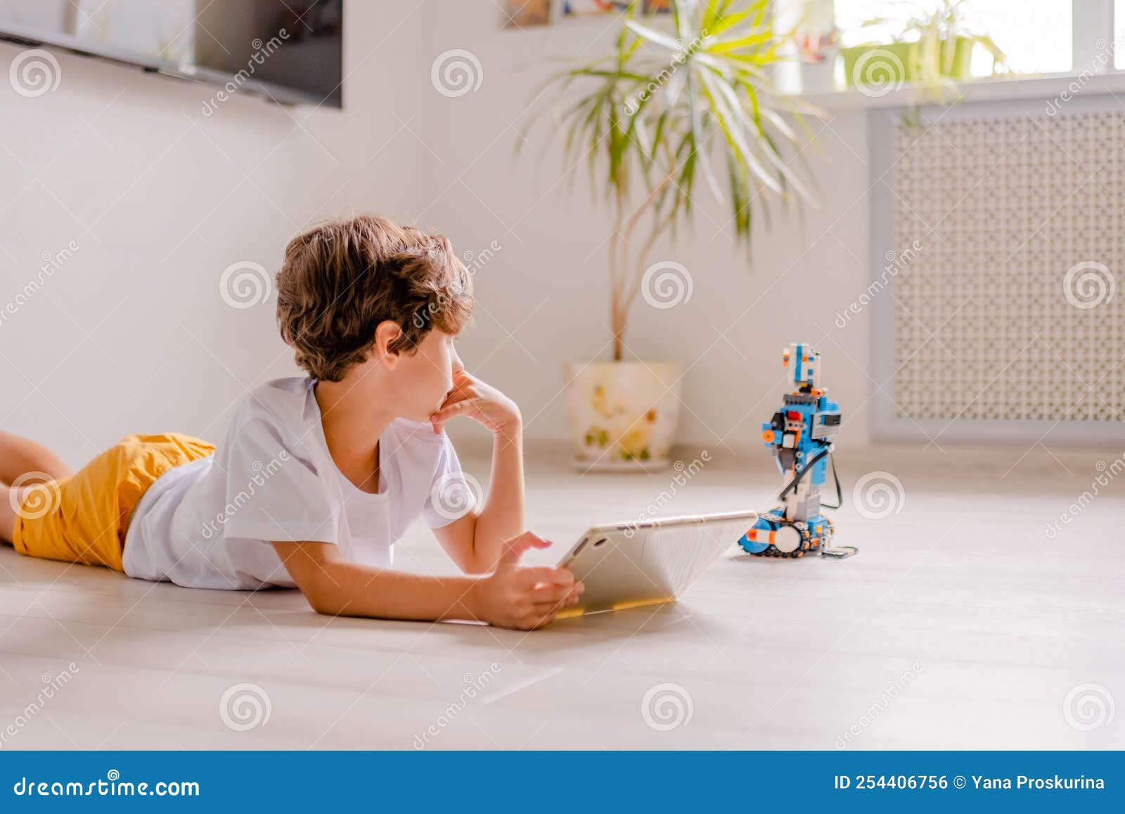 Kid Programming Robot from Plastics Details and Programmed on Tablet ...