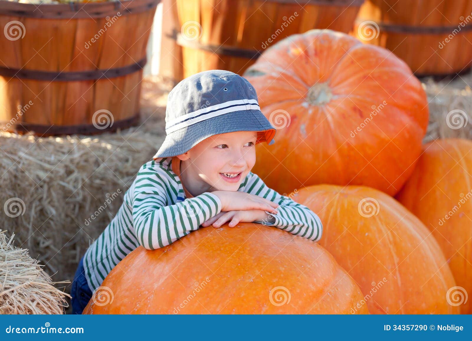 Kid at pumpkin patch stock photo. Image of outside, adorable - 34357290