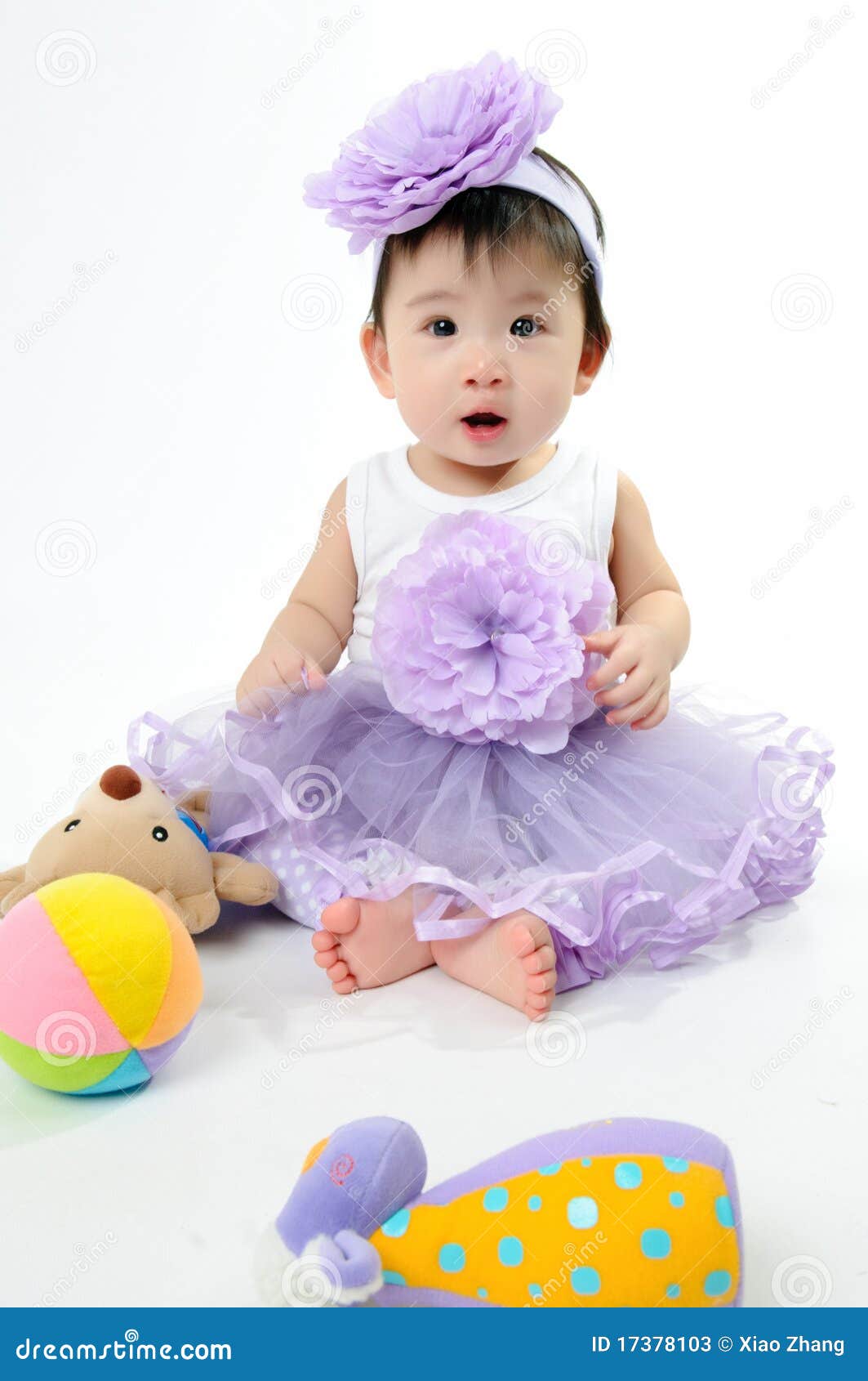 Kid in purple dress stock image. Image of concentrated - 17378103