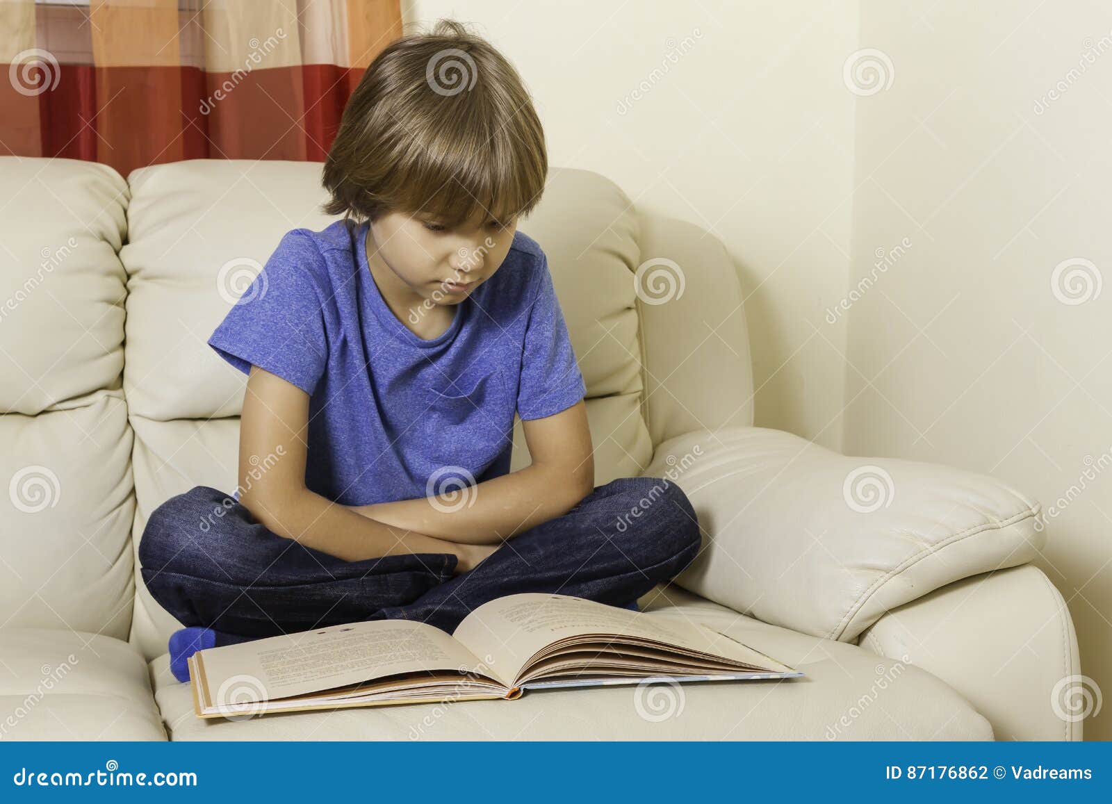 Kid reading a book at home stock photo. Image of literature - 87176862