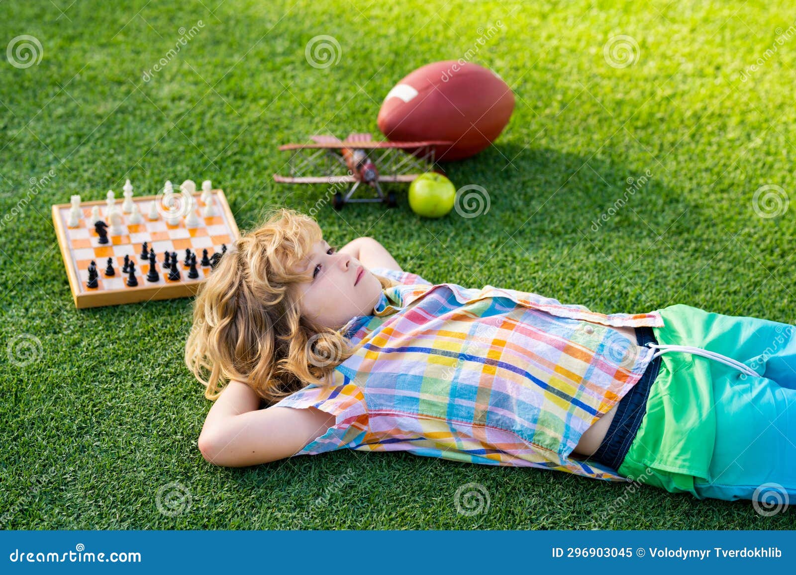 Kid Relax in Park, Laying on Grass, Daydreaming. Board Game in Backyard ...