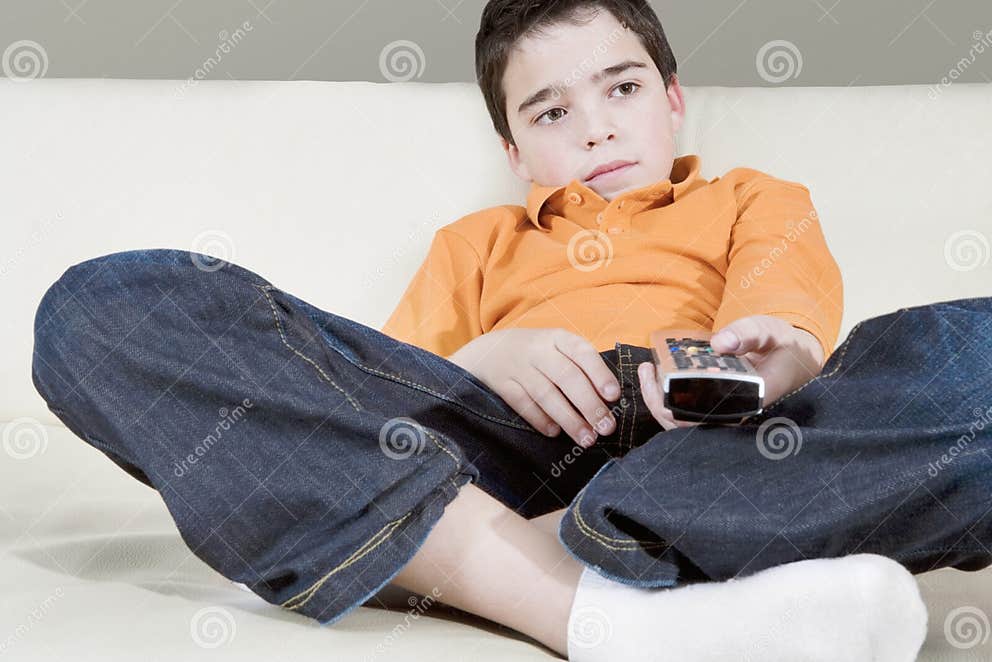 Kid with Remote Control stock photo. Image of alone, orange - 28833364