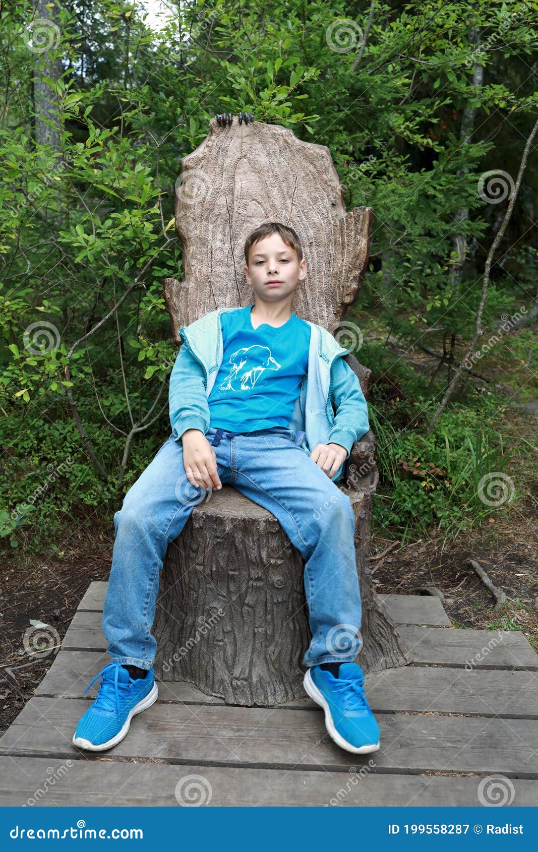 Kid resting on stump chair stock image. Image of relaxation - 199558287