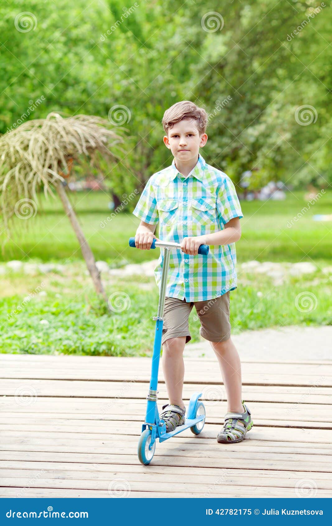 Kid rides a kick scooter stock image. Image of city, healthy - 42782175