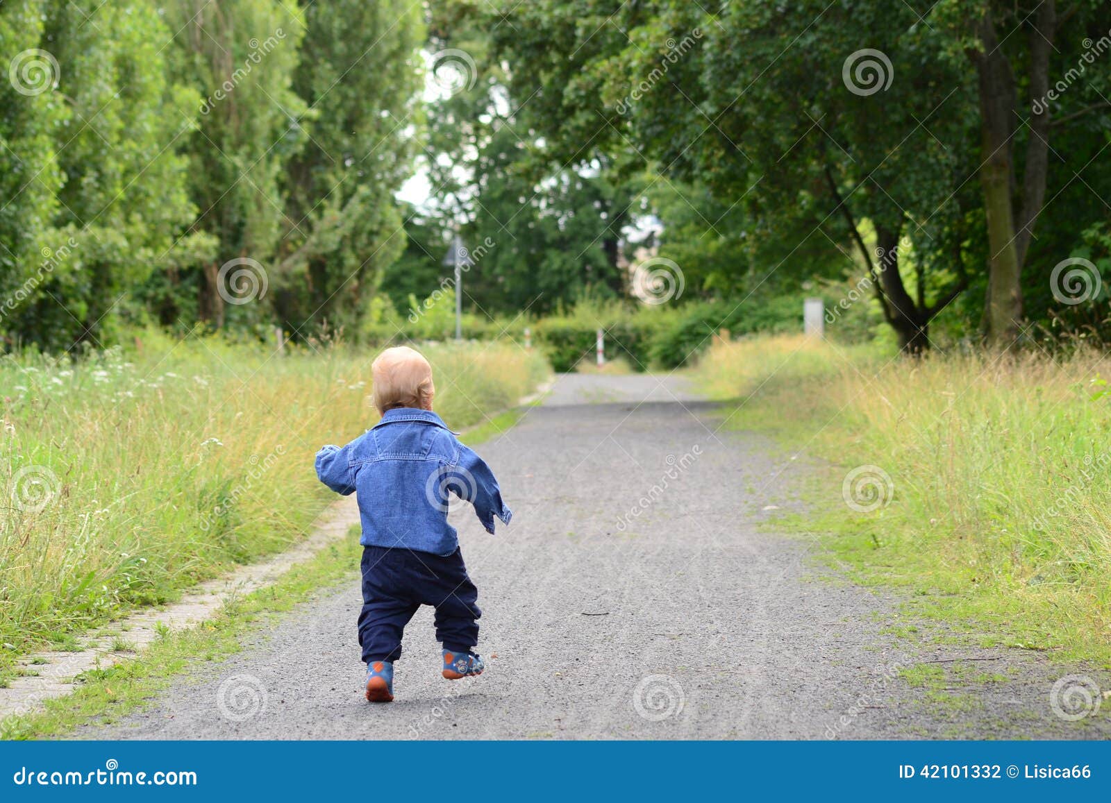Kid running on the track stock photo. Image of park, shirt - 42101332
