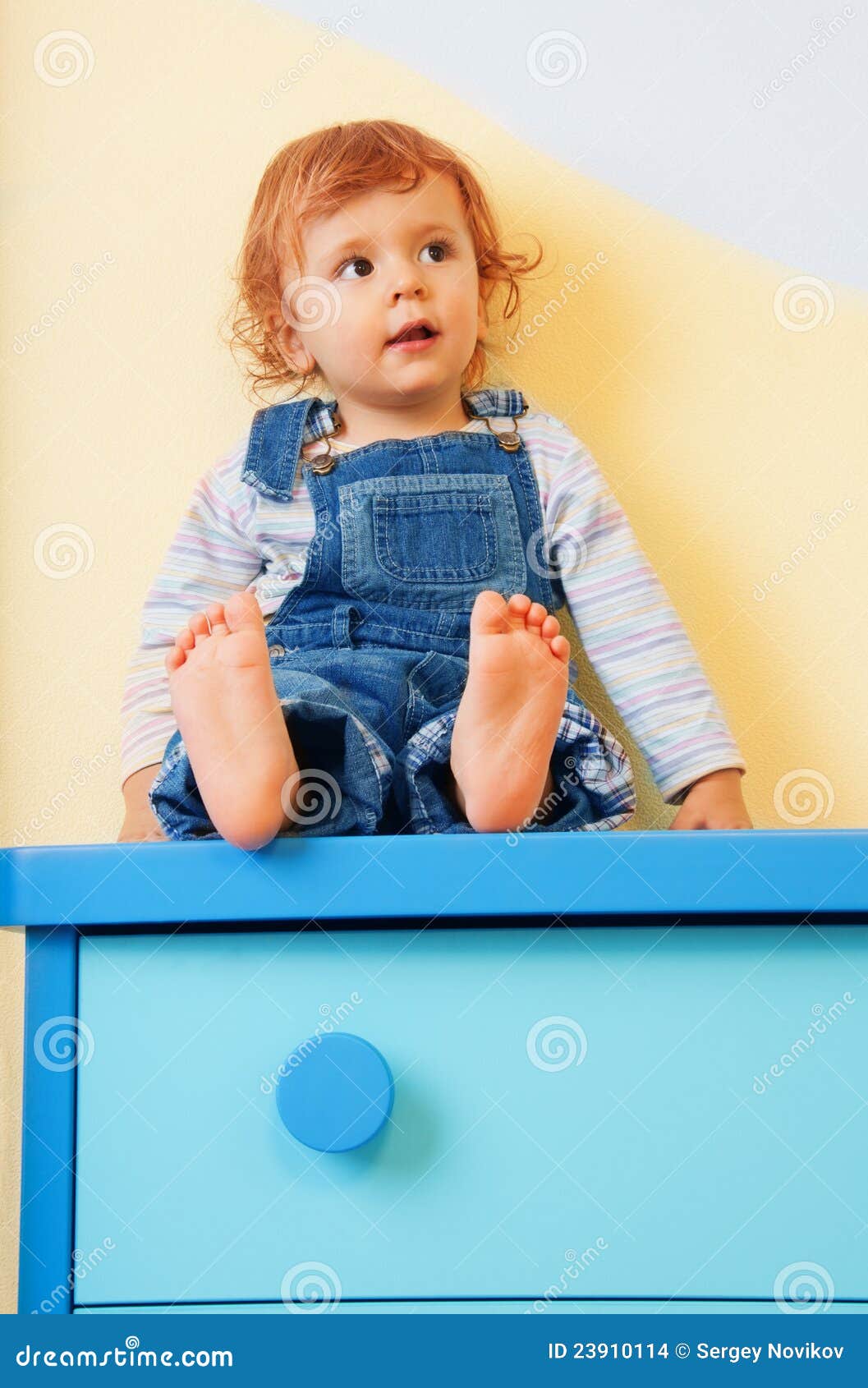 Kid sitting on furniture stock photo. Image of casual - 23910114