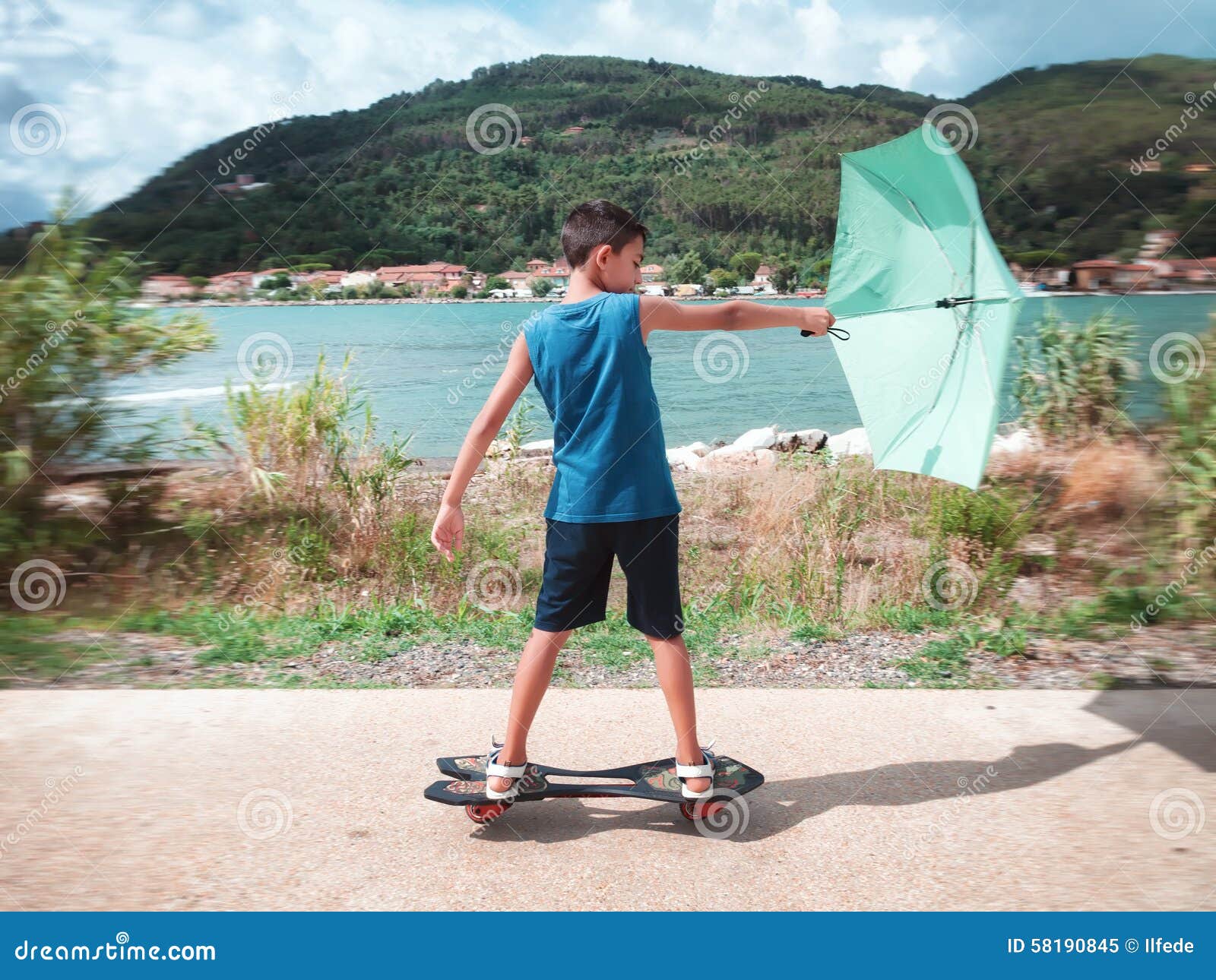 Kid on Skateboard with Wind and Umbrella Stock Image - Image of skater ...
