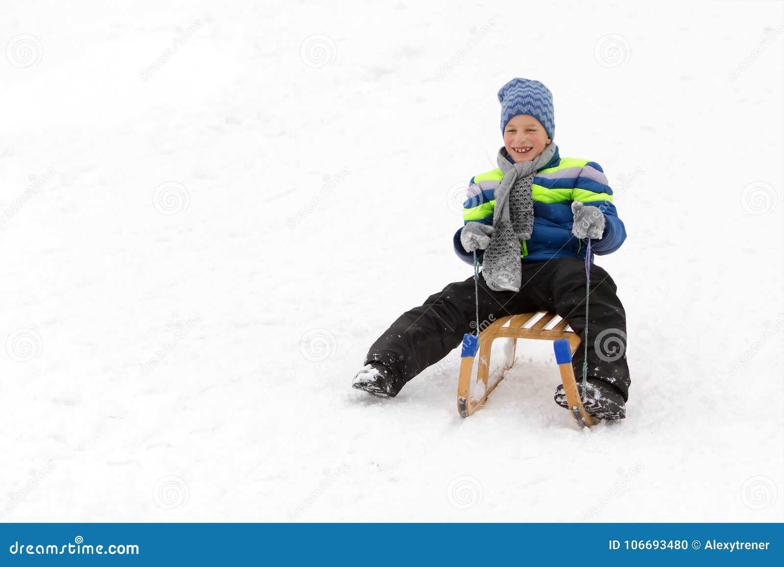 Kid Sliding with Sledge in the Snow. Stock Photo - Image of recreation ...