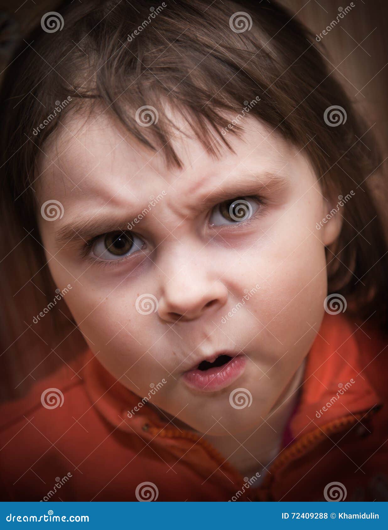 Kid with a sour face. stock photo. Image of childhood - 72409288