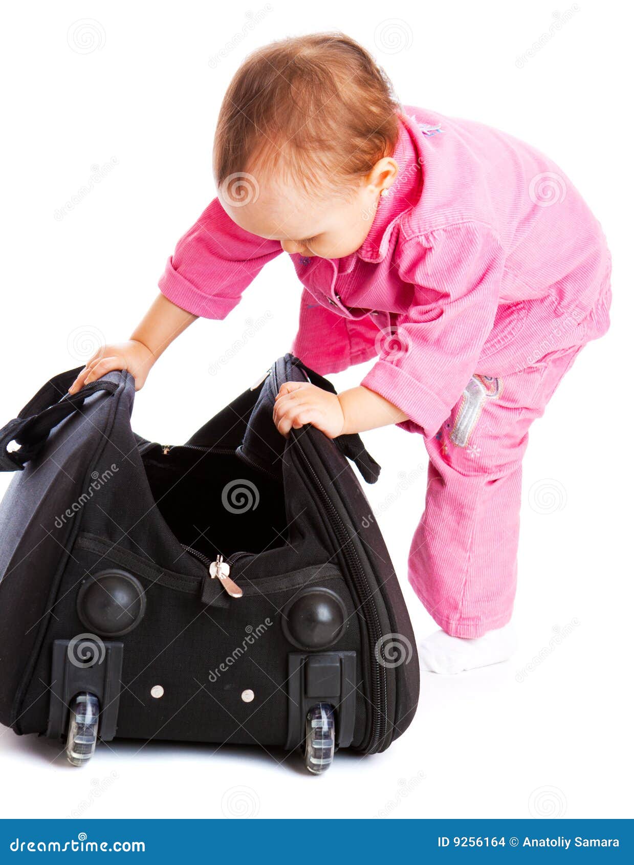 Kid stepping into bag stock photo. Image of pink, black - 9256164