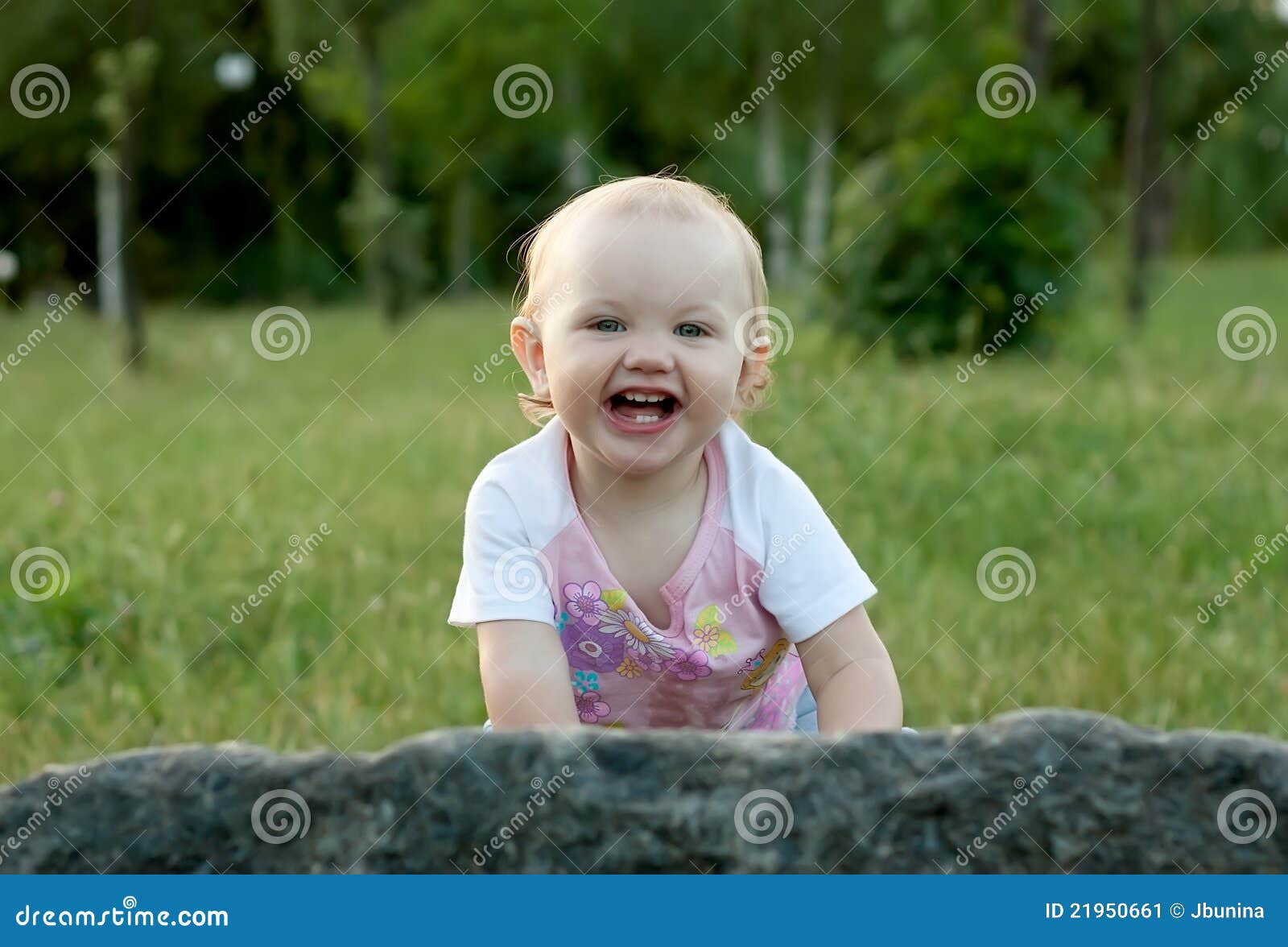 Kid on the stone stock image. Image of smile, happy, tree - 21950661