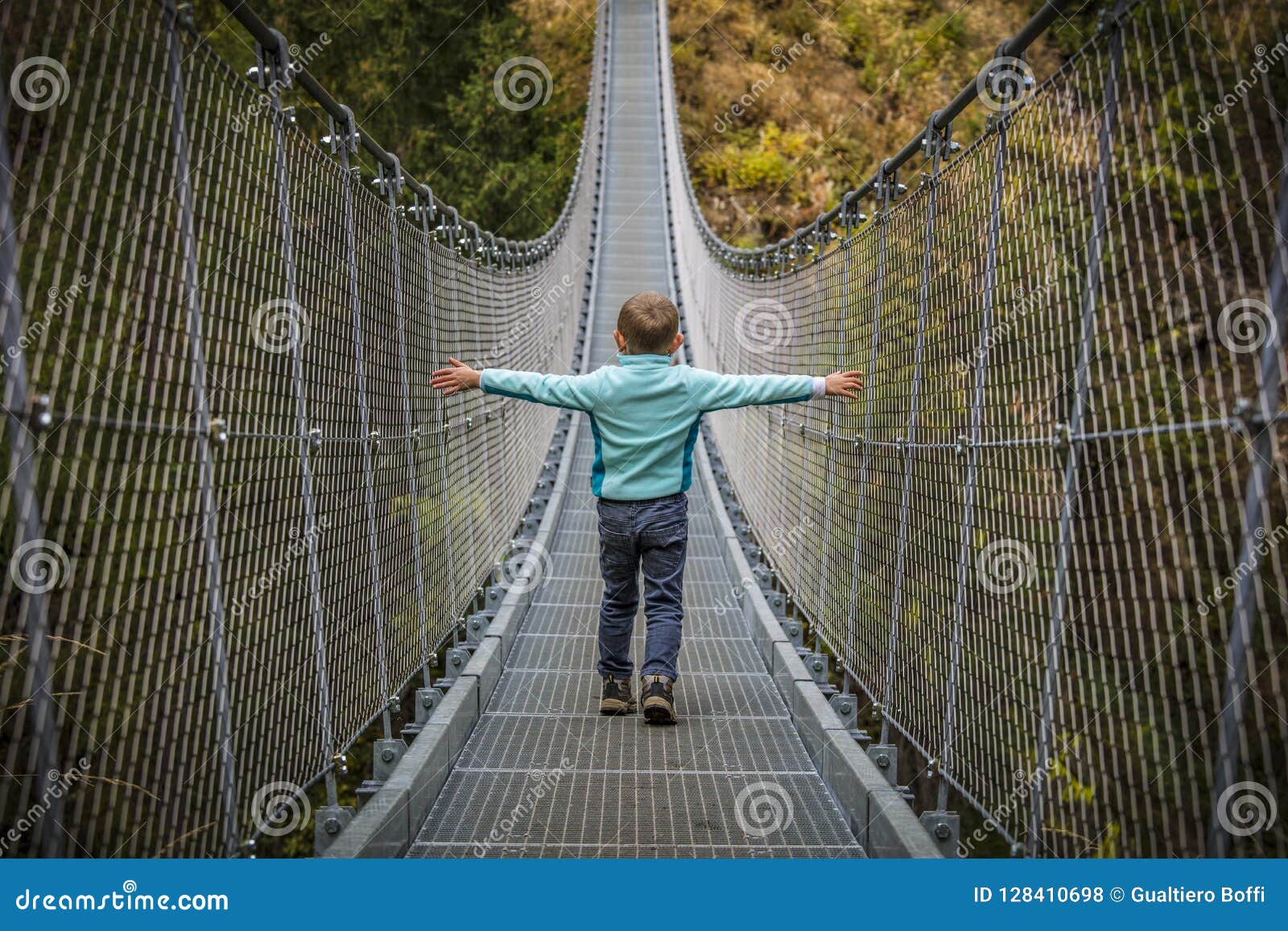 Kid on suspended bridge stock photo. Image of nature - 128410698