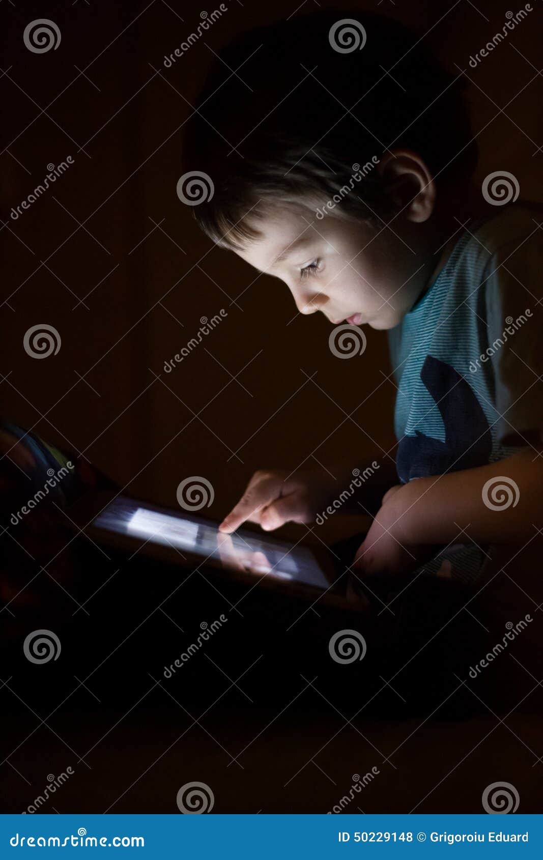 Kid with Tablet in the Dark Stock Photo - Image of cartoons, education ...