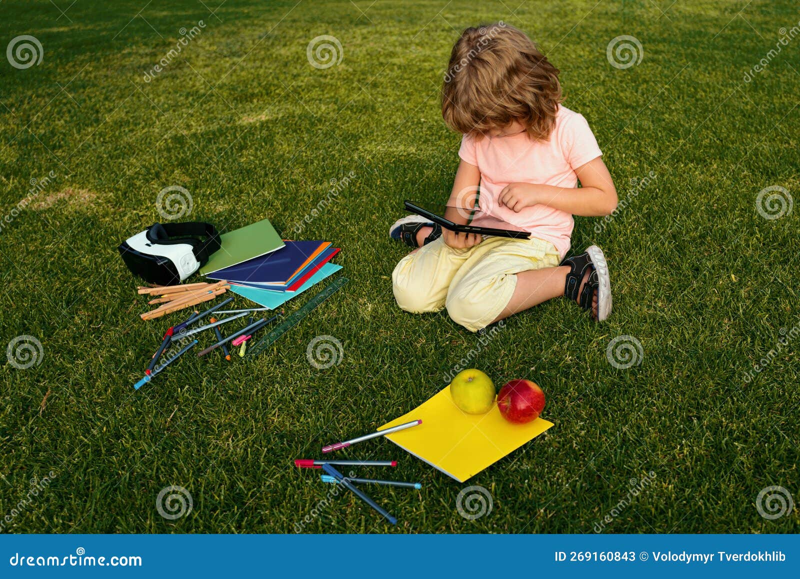 Kid with Tablet Sit on Grass in Park. Kids Education, Learning and ...