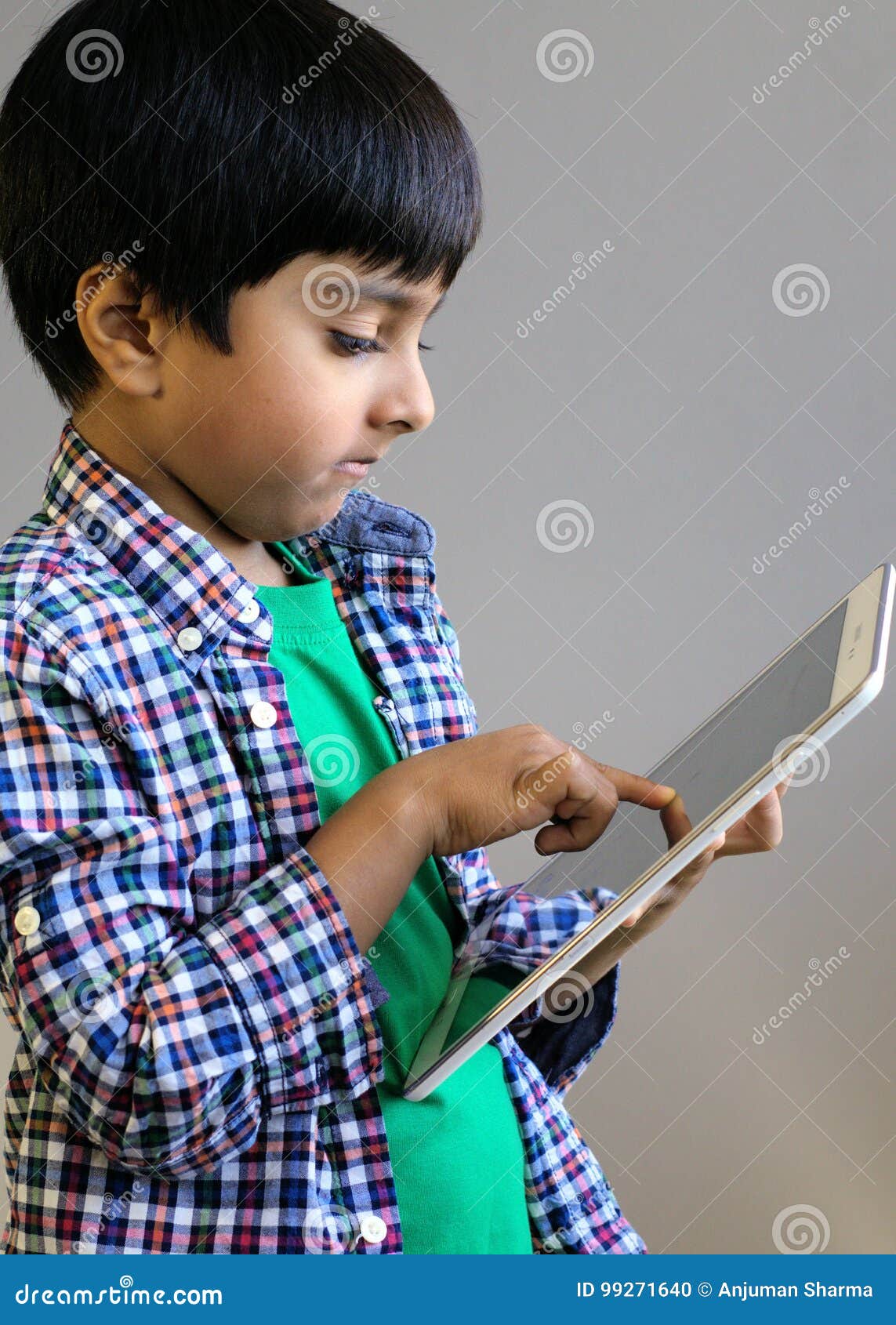 Kid Tapping on Tablet Computer. Child Using Tablet. Stock Photo - Image ...