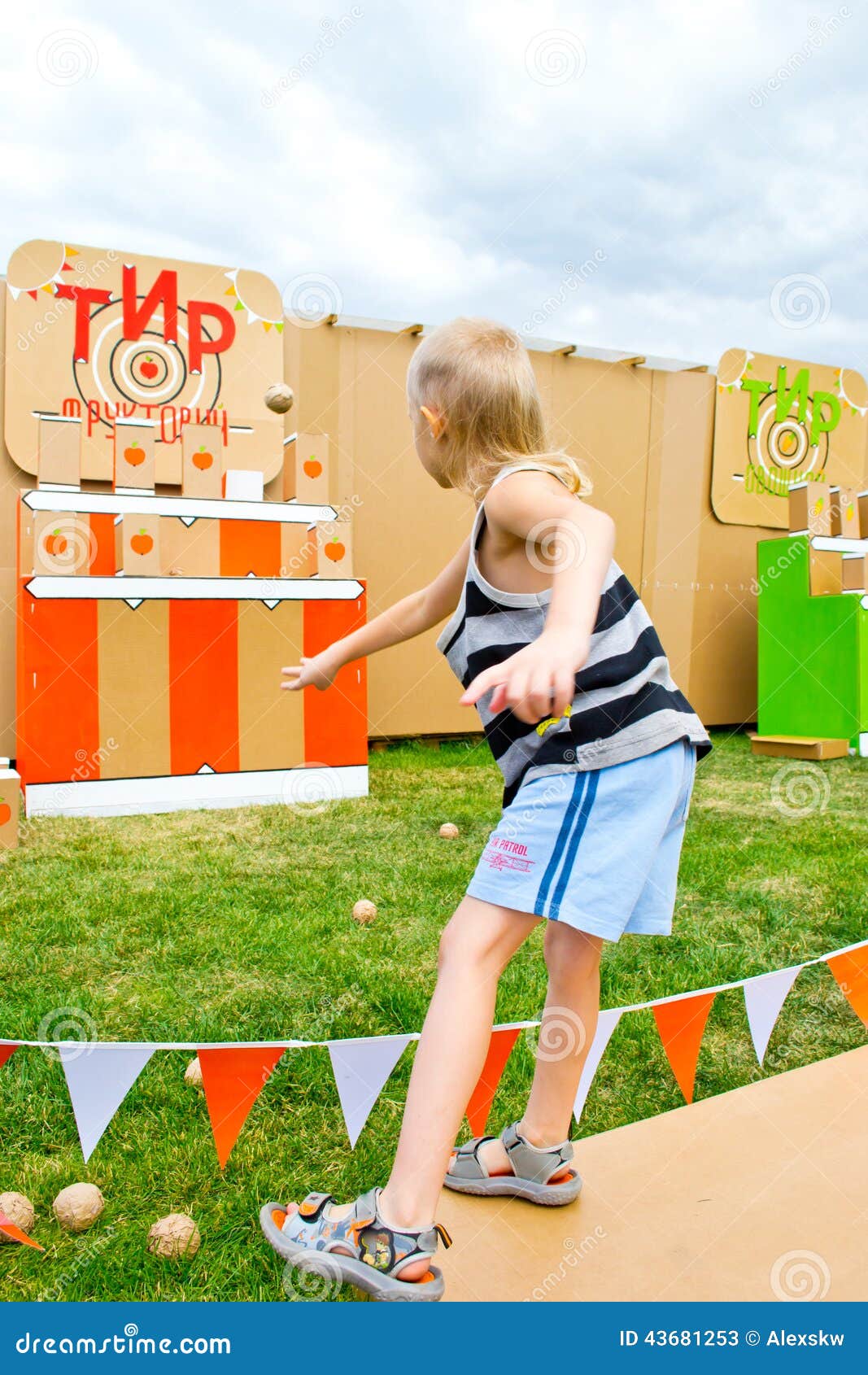 Kid Throwing Balls at a Target Stock Image - Image of emotions, casual ...
