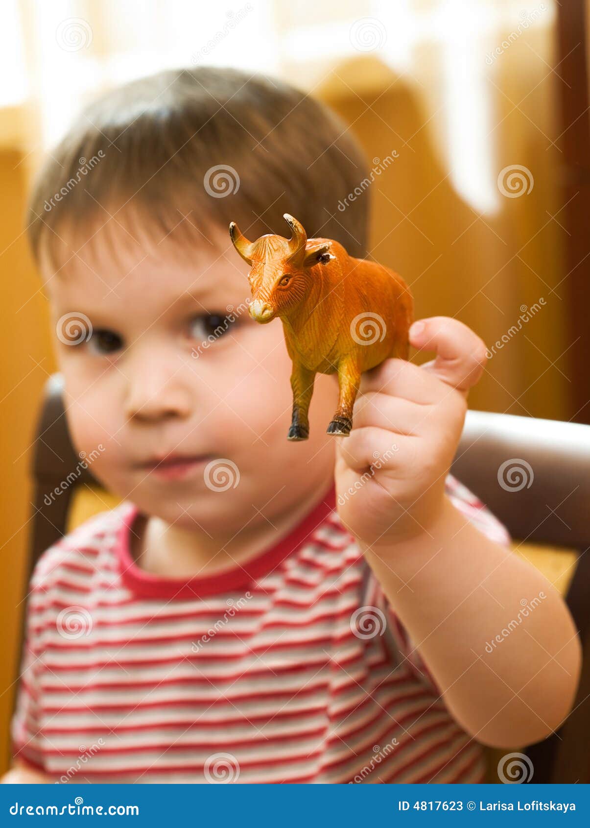 Kid with a toy cow stock image. Image of show, playful - 4817623
