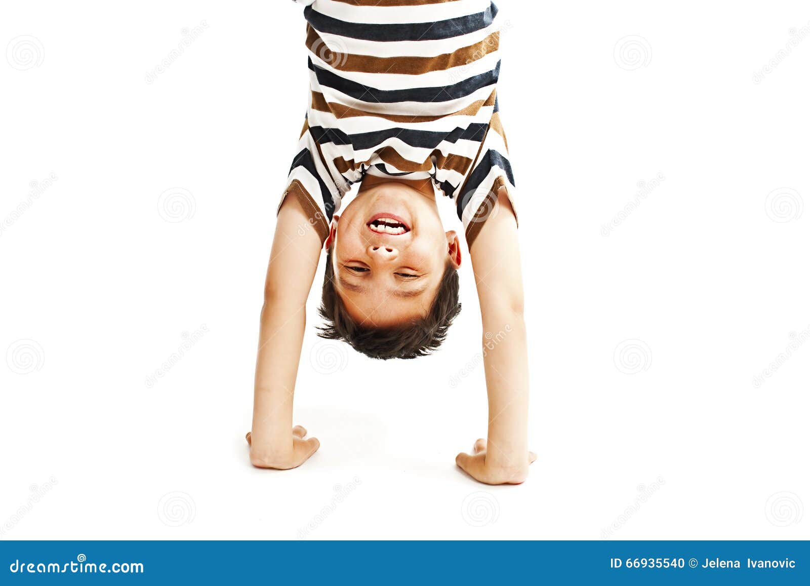 A Kid Upside Down Smiling To the Camera Stock Photo - Image of funny ...