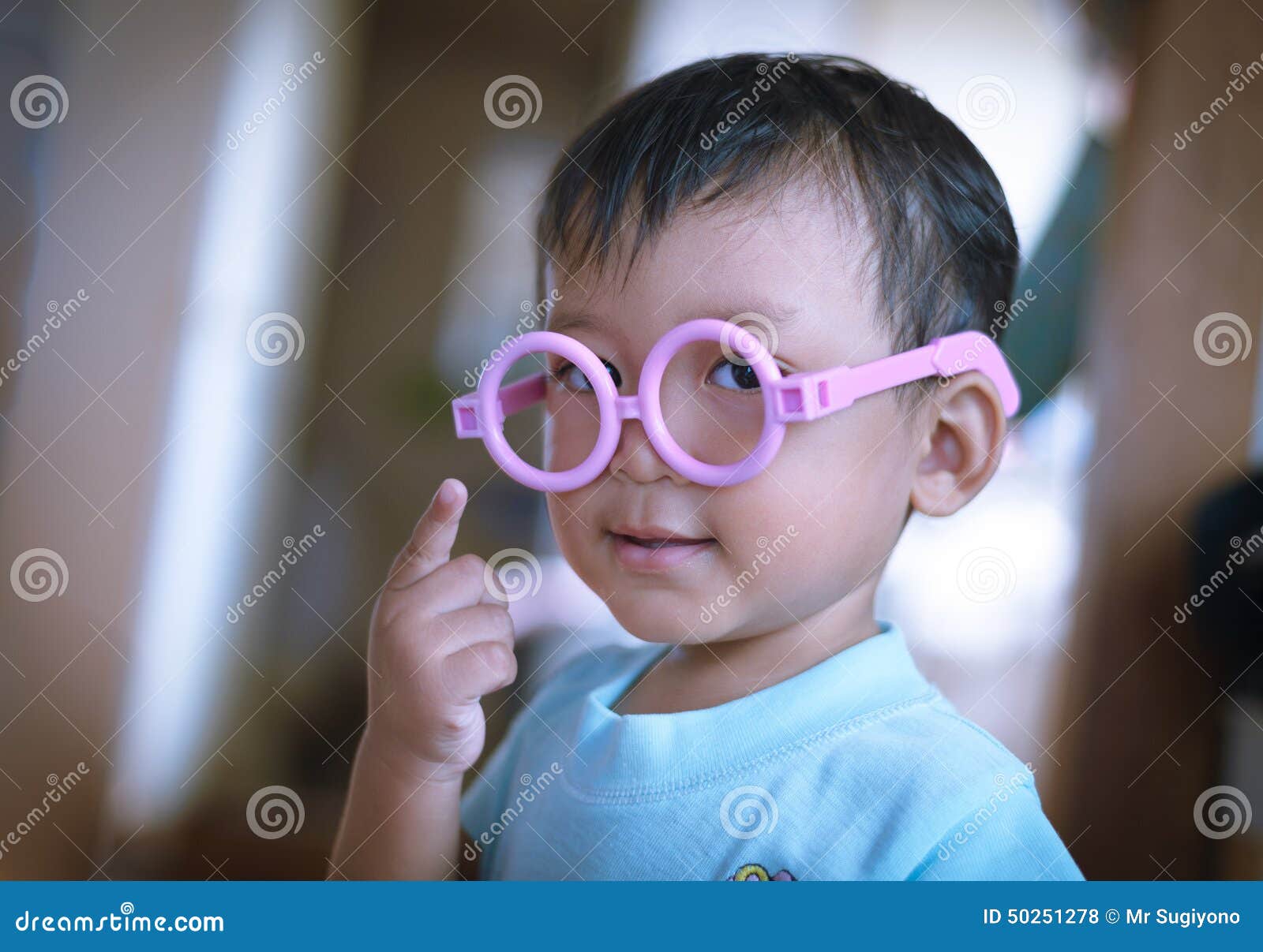 Kid using doctor glass toy stock photo. Image of glass - 50251278