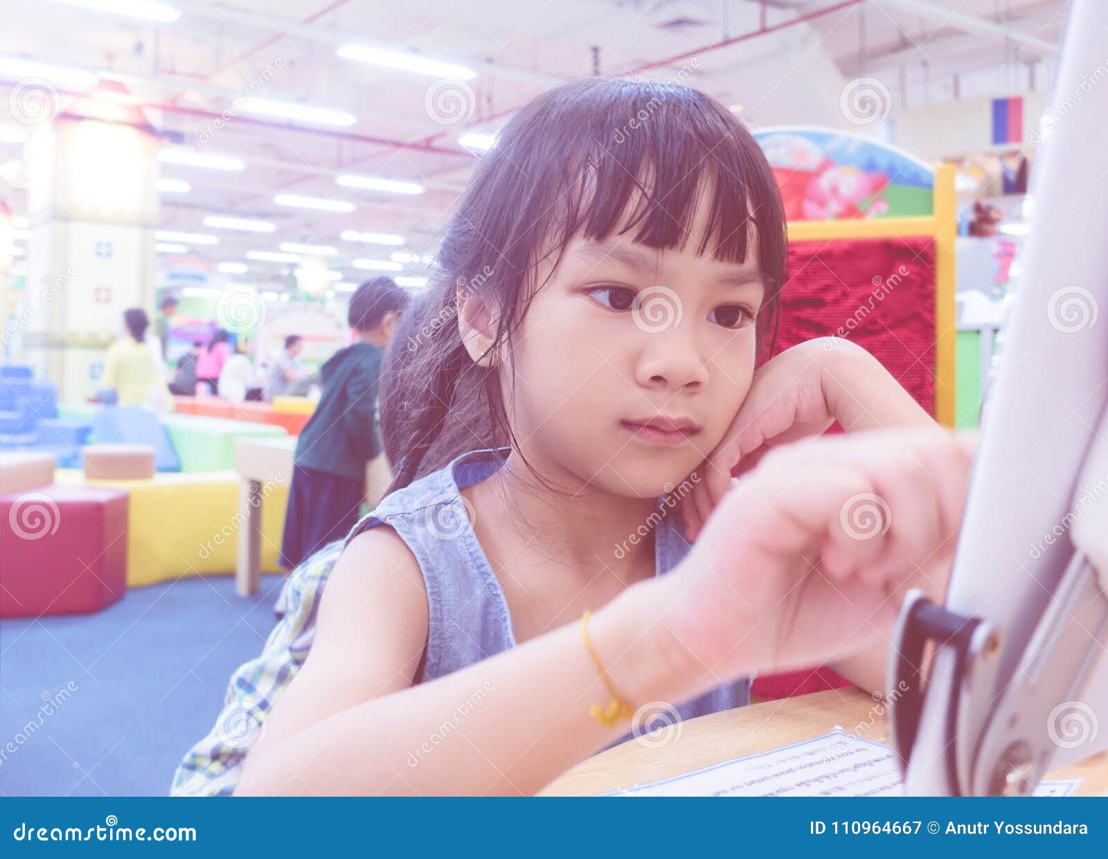 Kid Using Tablet in Classroom, Focusing on the Hand and Tablet Stock ...