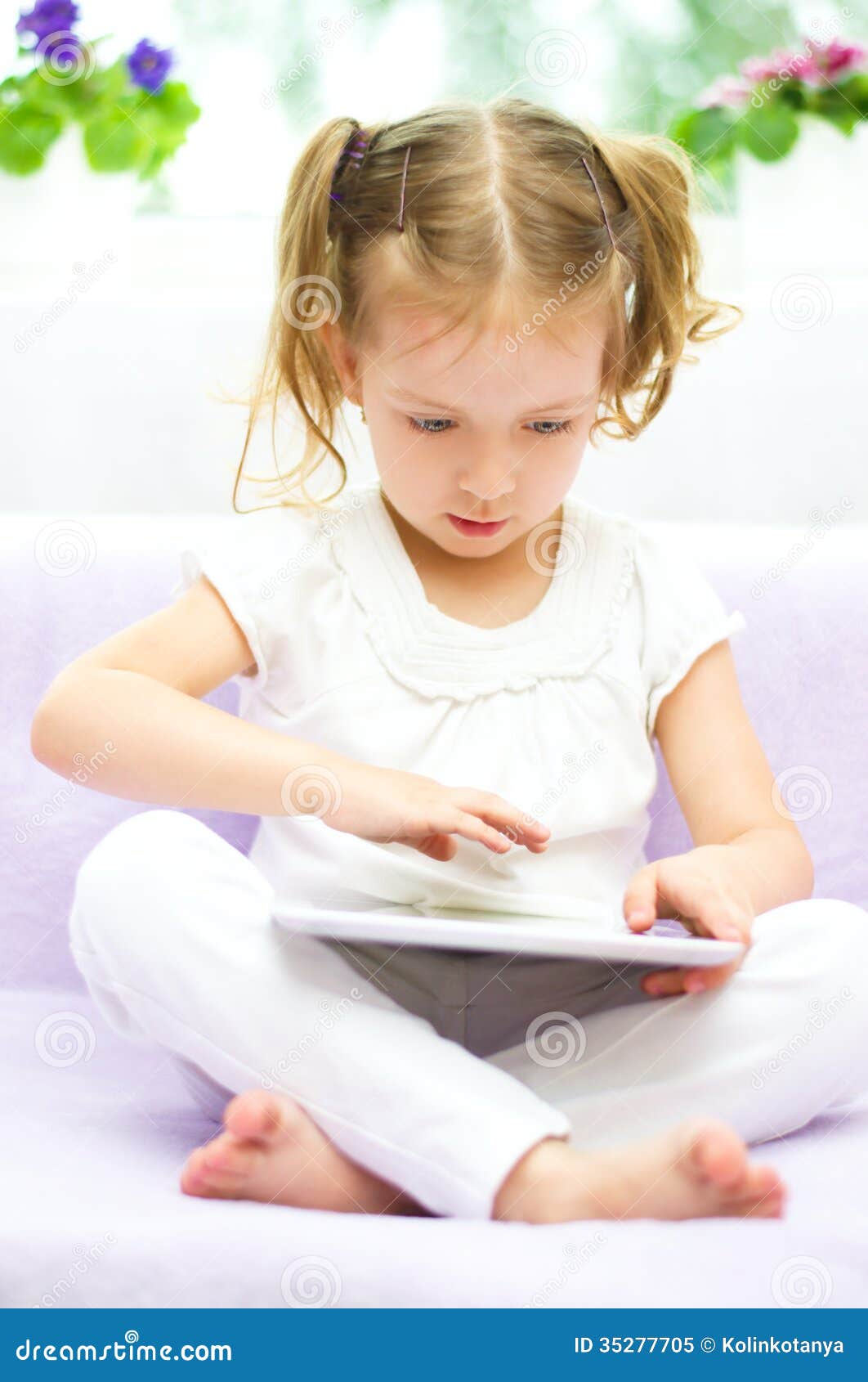 Kid using tablet computer stock image. Image of happiness - 35277705