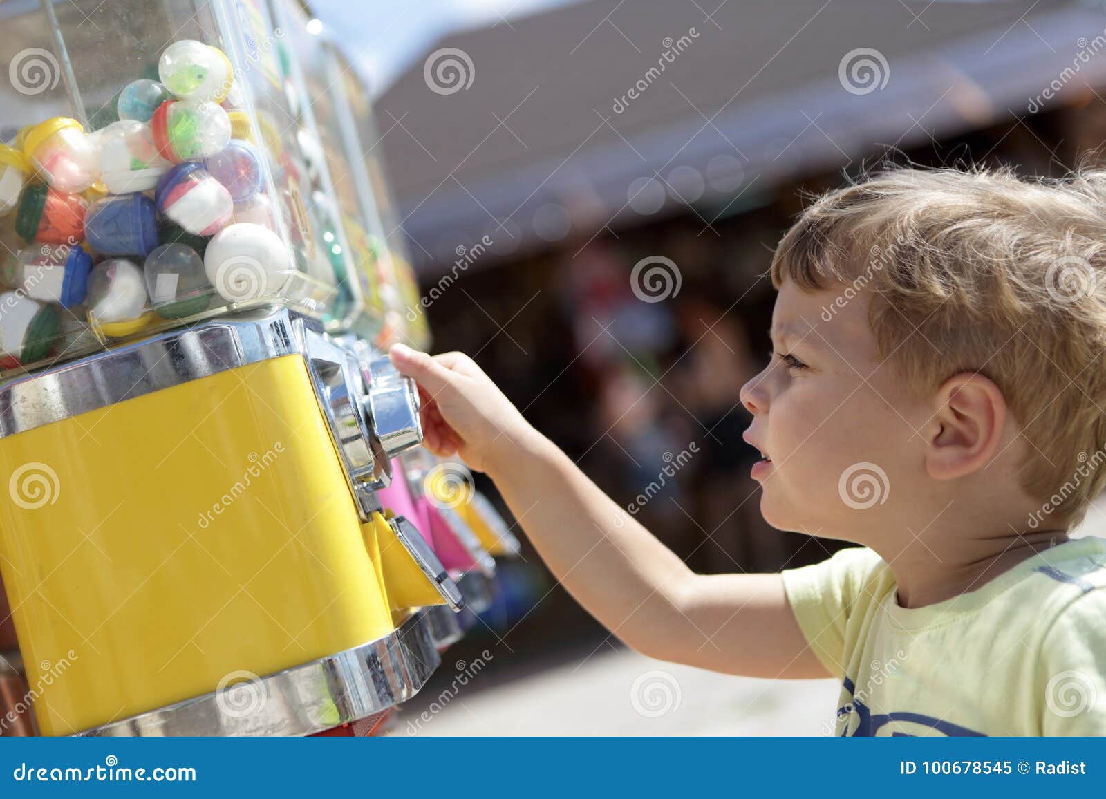 Kid using vending toys stock image. Image of baby, person - 100678545