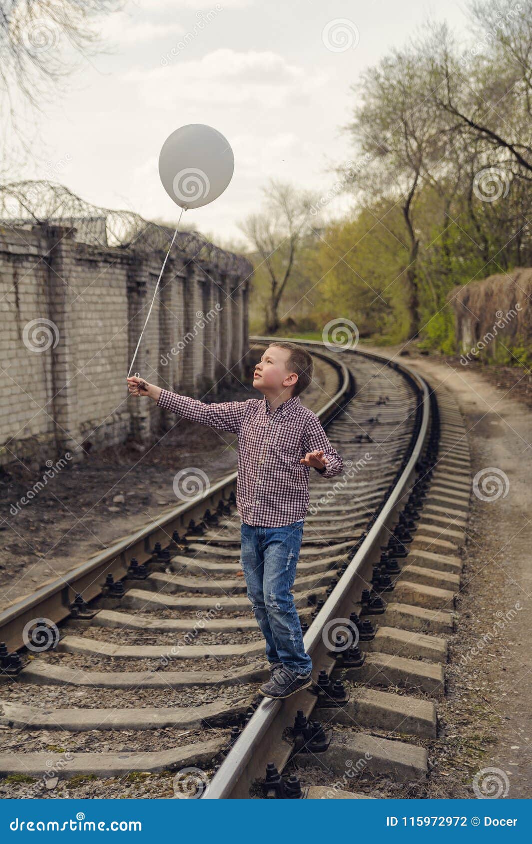 Kid walk on a rails stock photo. Image of walk, stroll - 115972972