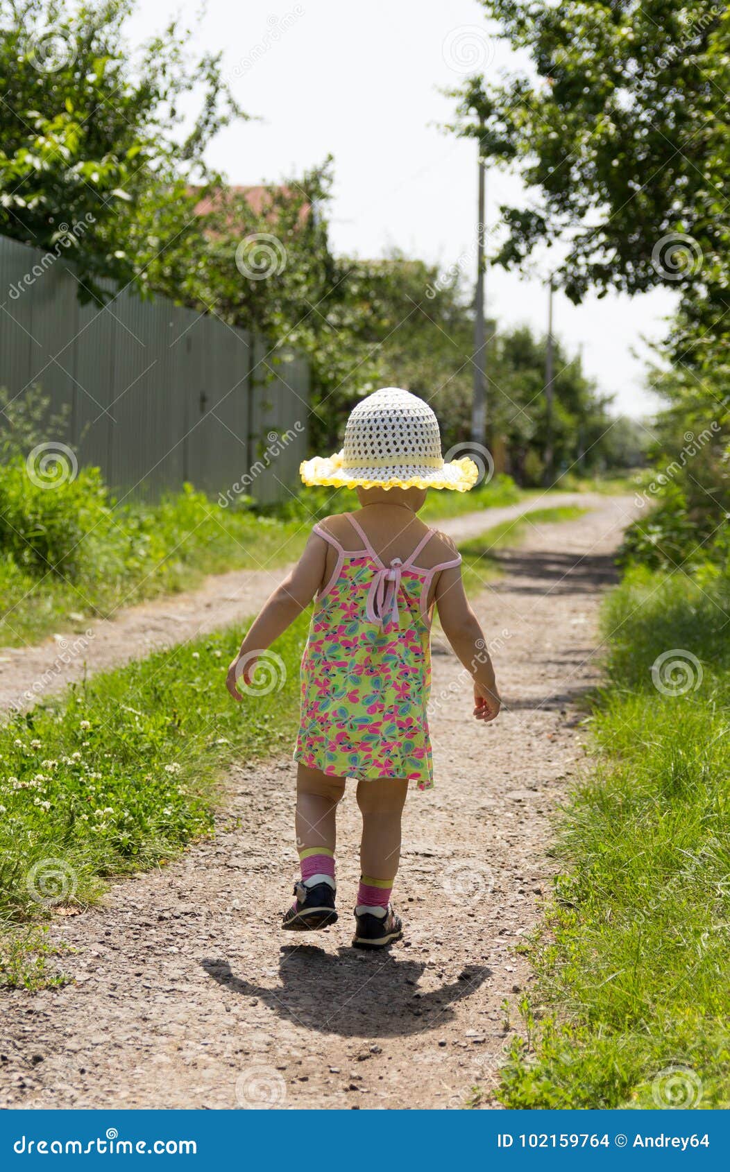 The Kid is Walking Along the Path Stock Photo - Image of childhood ...