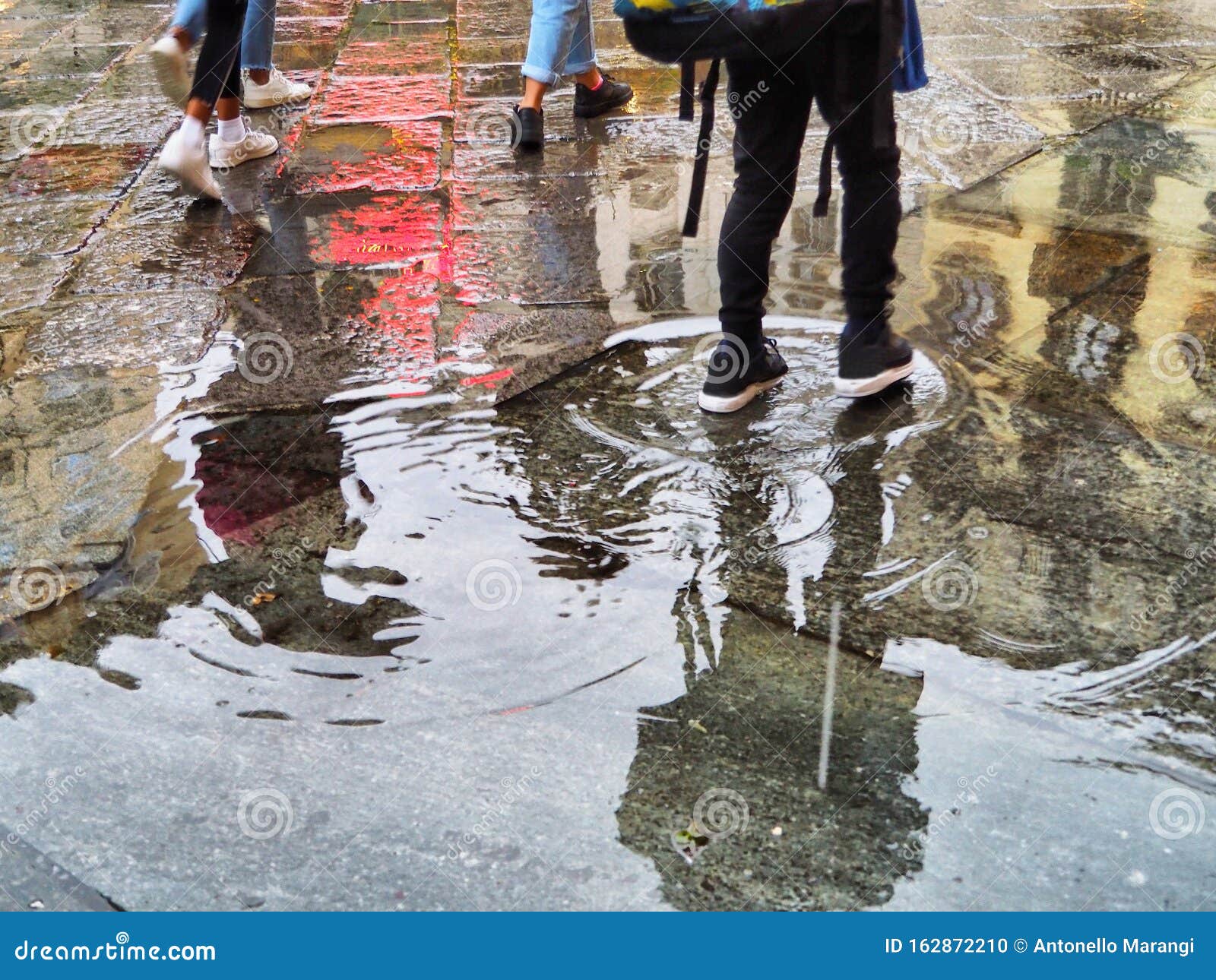 Kid Walking in the Puddle of Water after the Rainstorm Stock Photo ...
