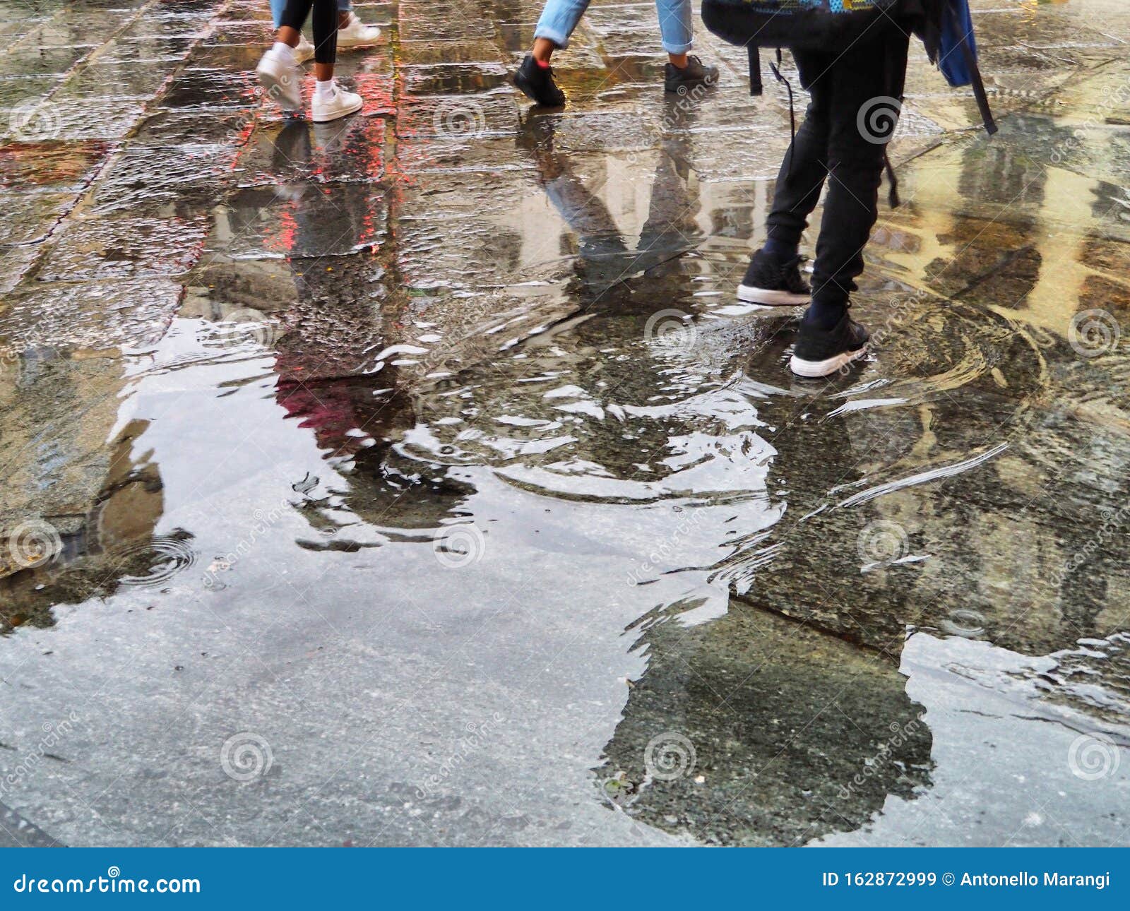 Kid Walking in the Puddle of Water after the Rainstorm Stock Image ...