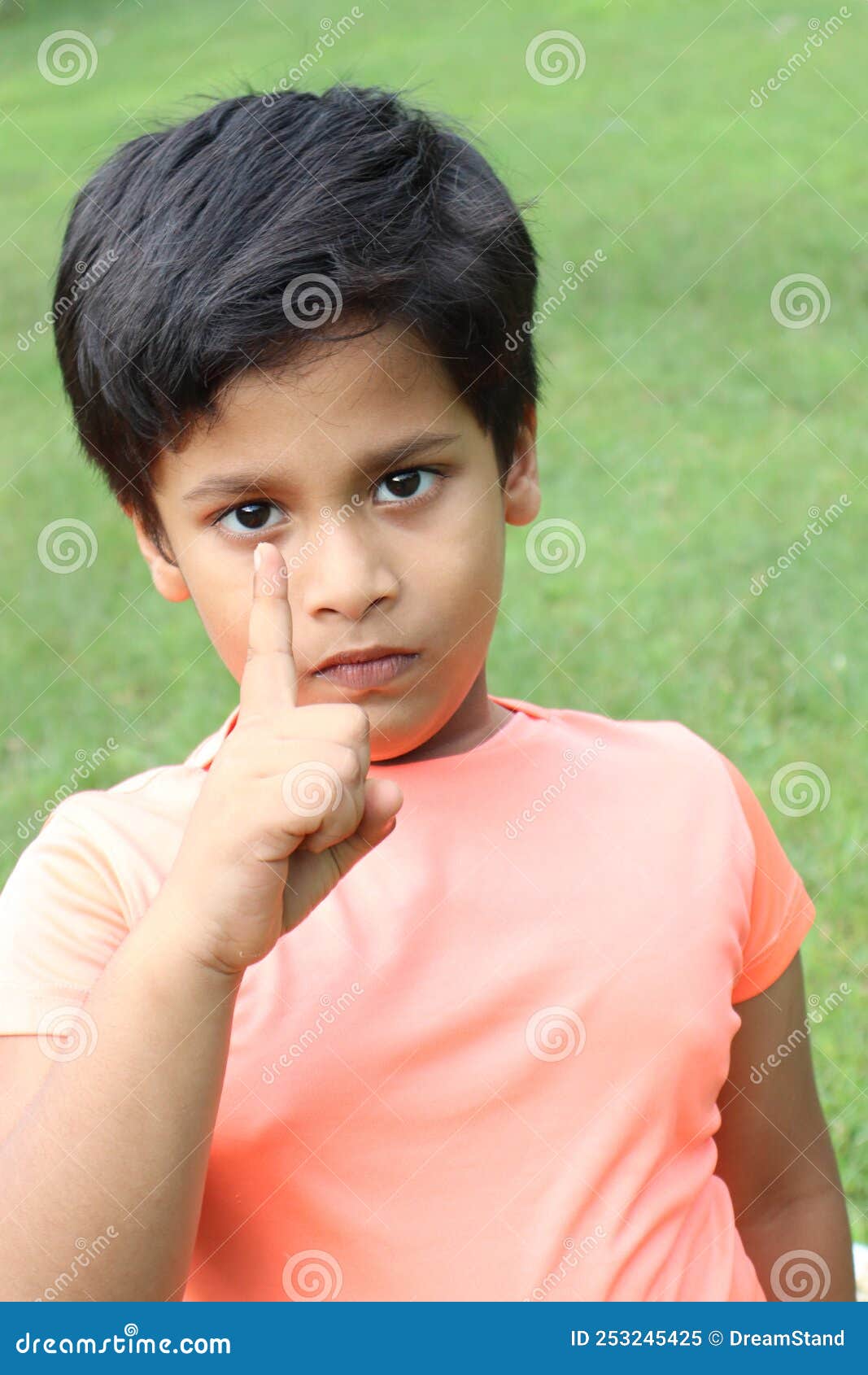 A Kid with a Warning Expression Stock Image - Image of ominous ...