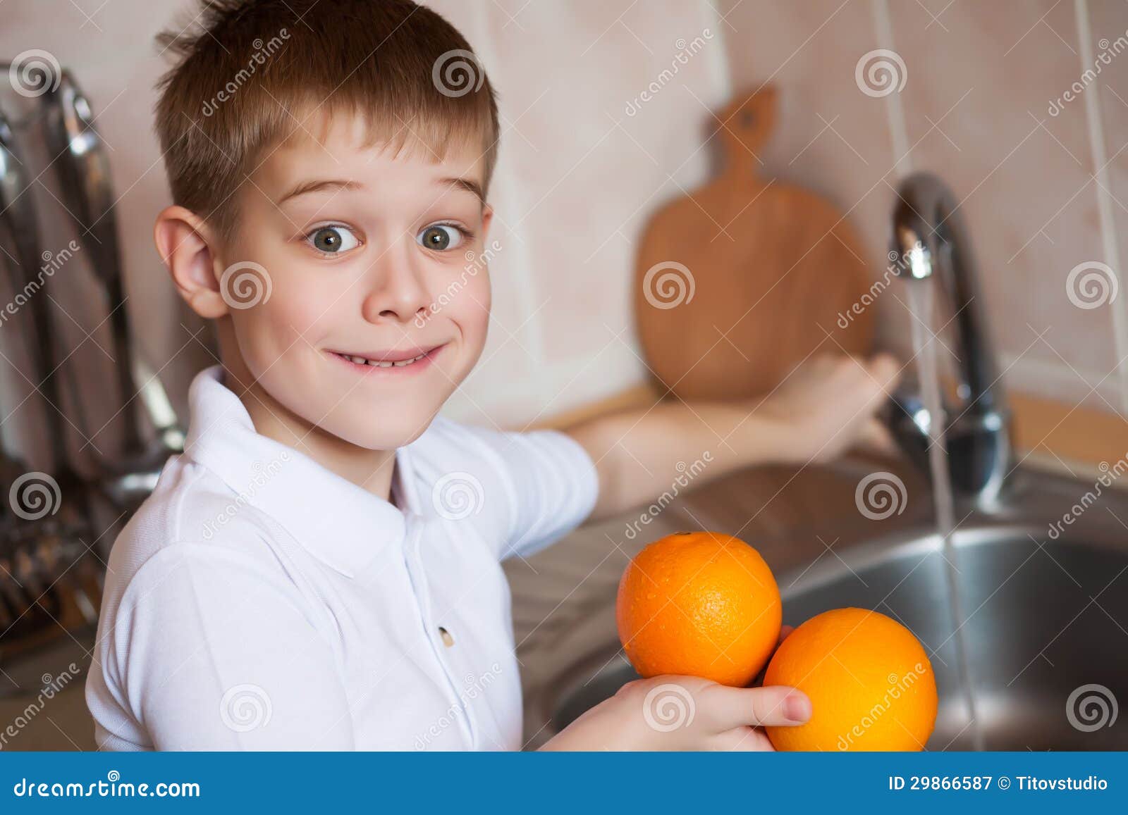 Little Boy is Washing Fruit in the Kitchen Stock Image - Image of water ...