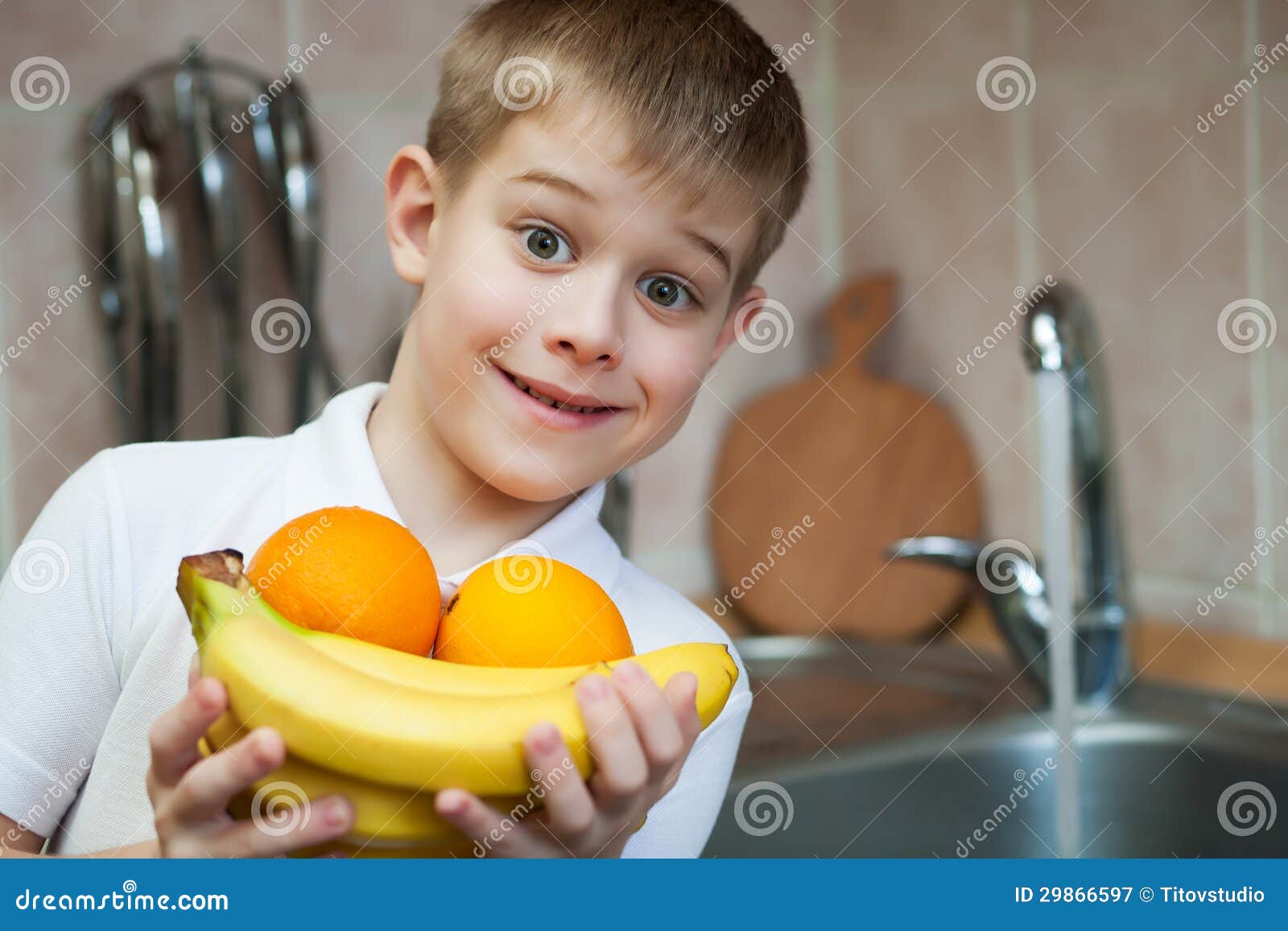 Little Boy is Washing Fruit in the Kitchen Stock Image - Image of ...