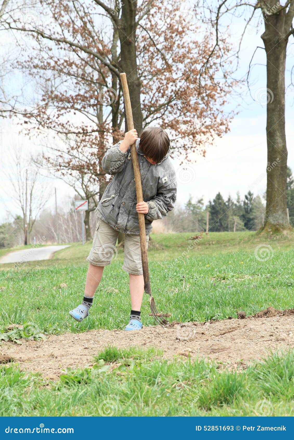 Kid working on the field stock image. Image of working - 52851693