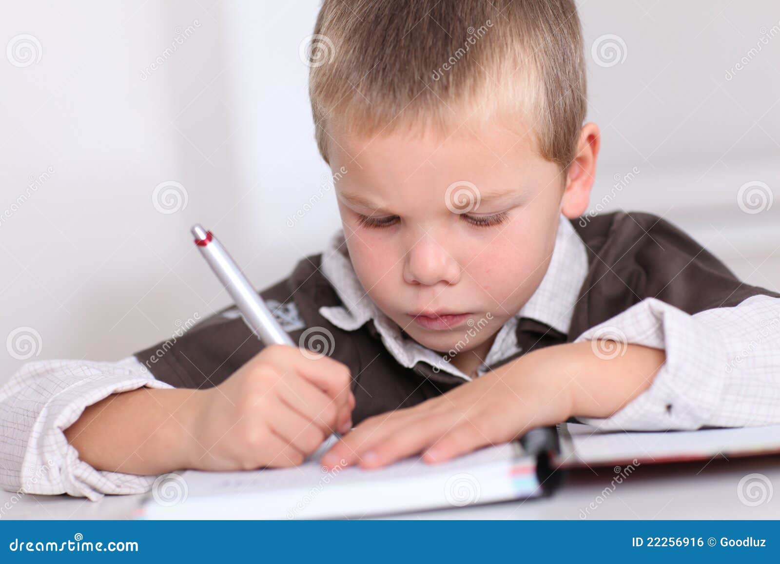 Kid writing on notebook stock photo. Image of little - 22256916
