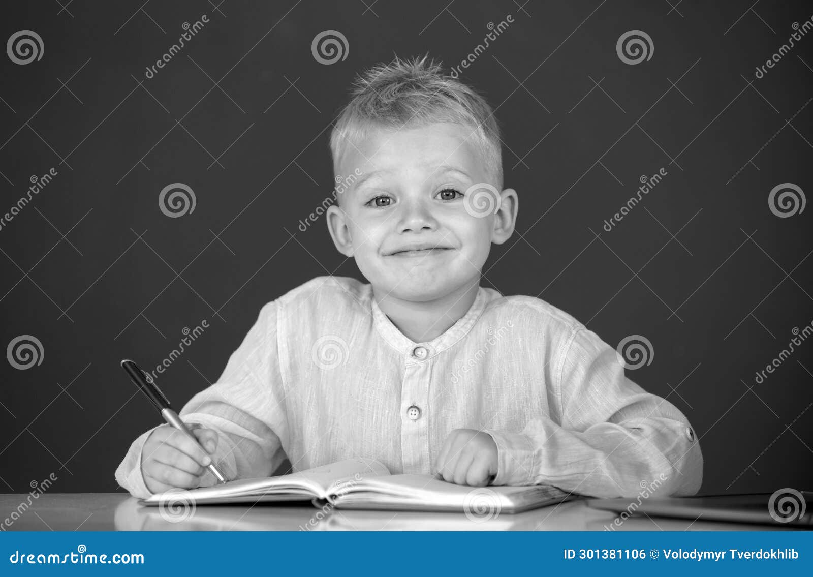 Kid Writing in Notebook in Class. Portrait of Funny Pupil of Primary ...