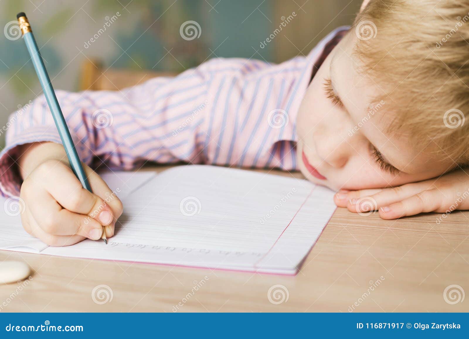 Kid writing in notebook stock image. Image of table - 116871917