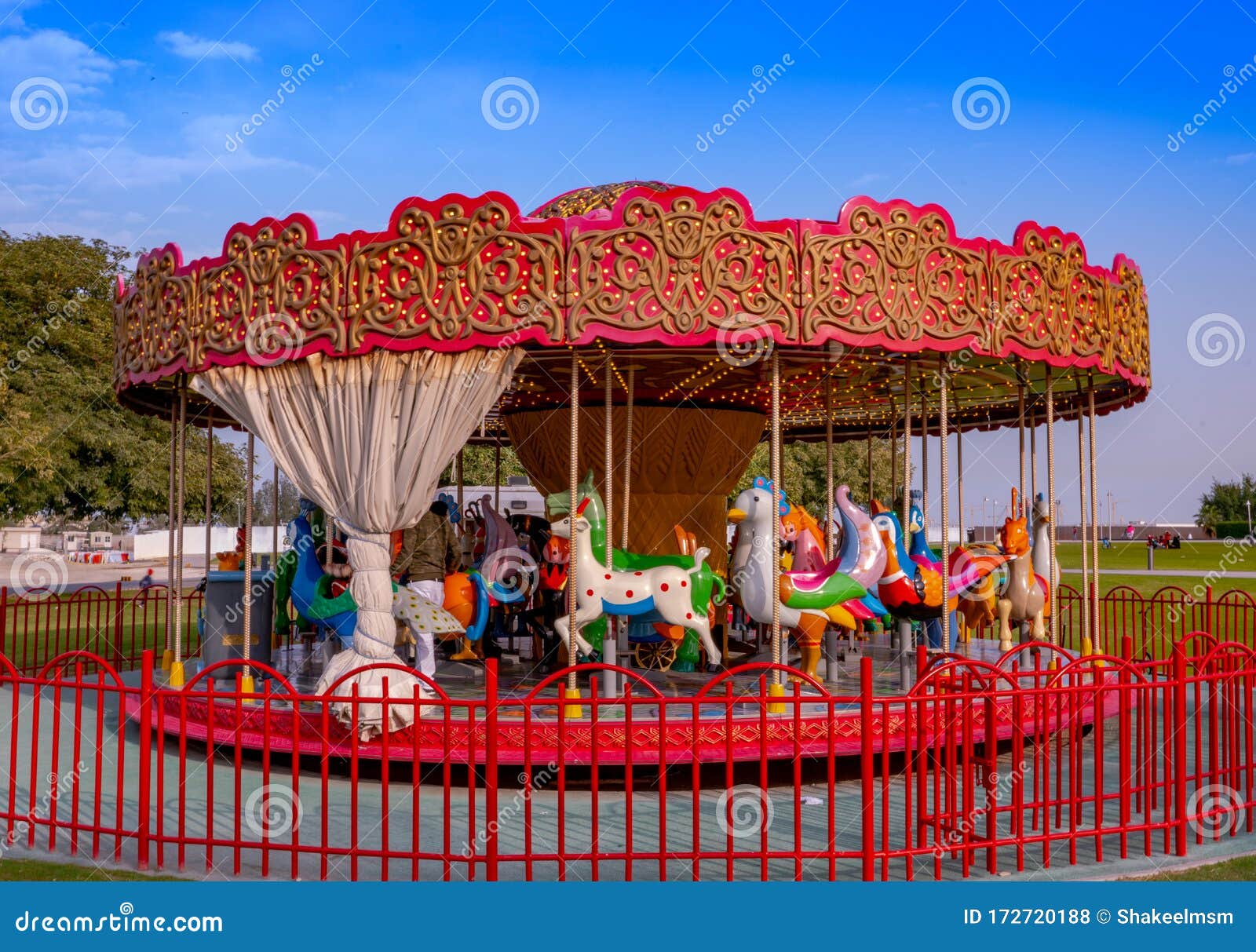 Kiddie Carousel Ride for Kids in the Park during Sunset Editorial Stock ...
