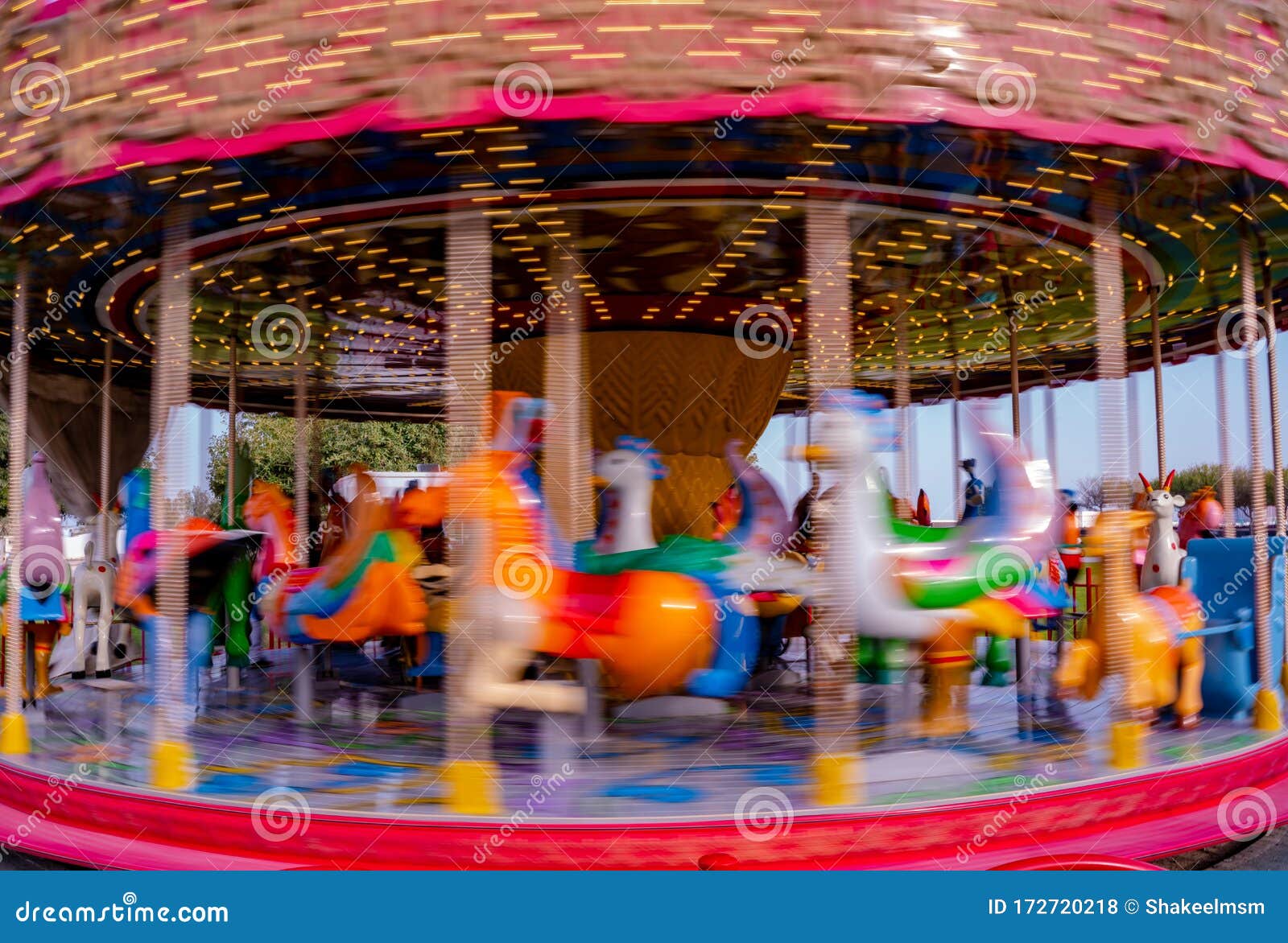 Kiddie Carousel Ride for Kids in the Park during Sunset Stock Photo ...