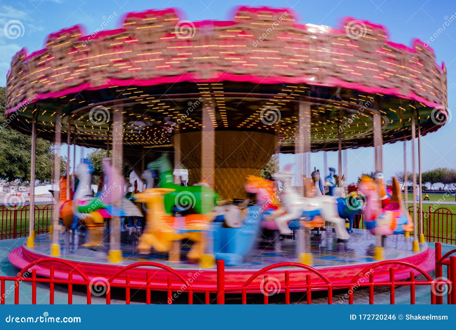 Kiddie Carousel Ride for Kids in the Park during Sunset Stock Photo ...