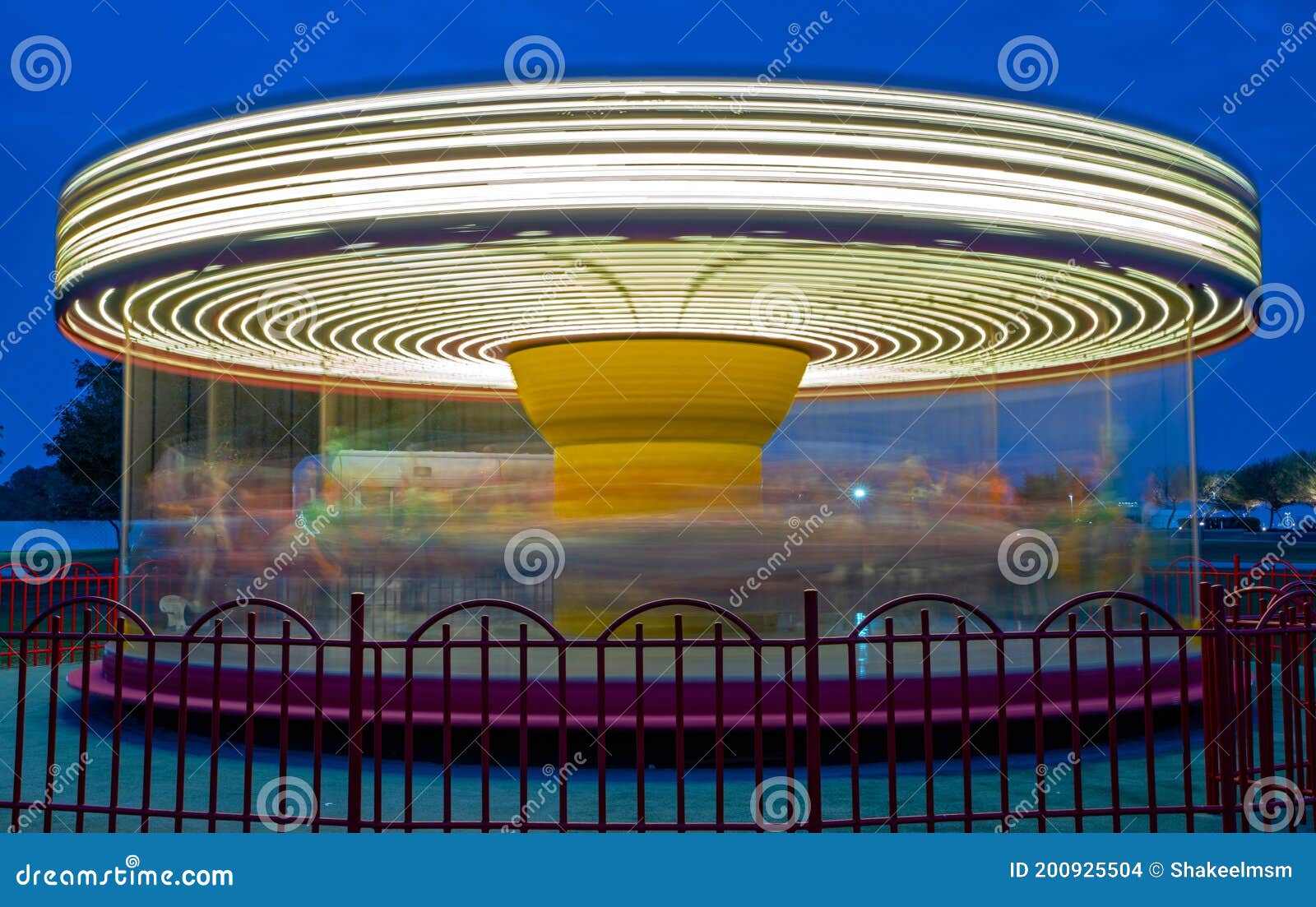 Kiddie Carousel Ride for Kids in the Park during Sunset Stock Photo ...