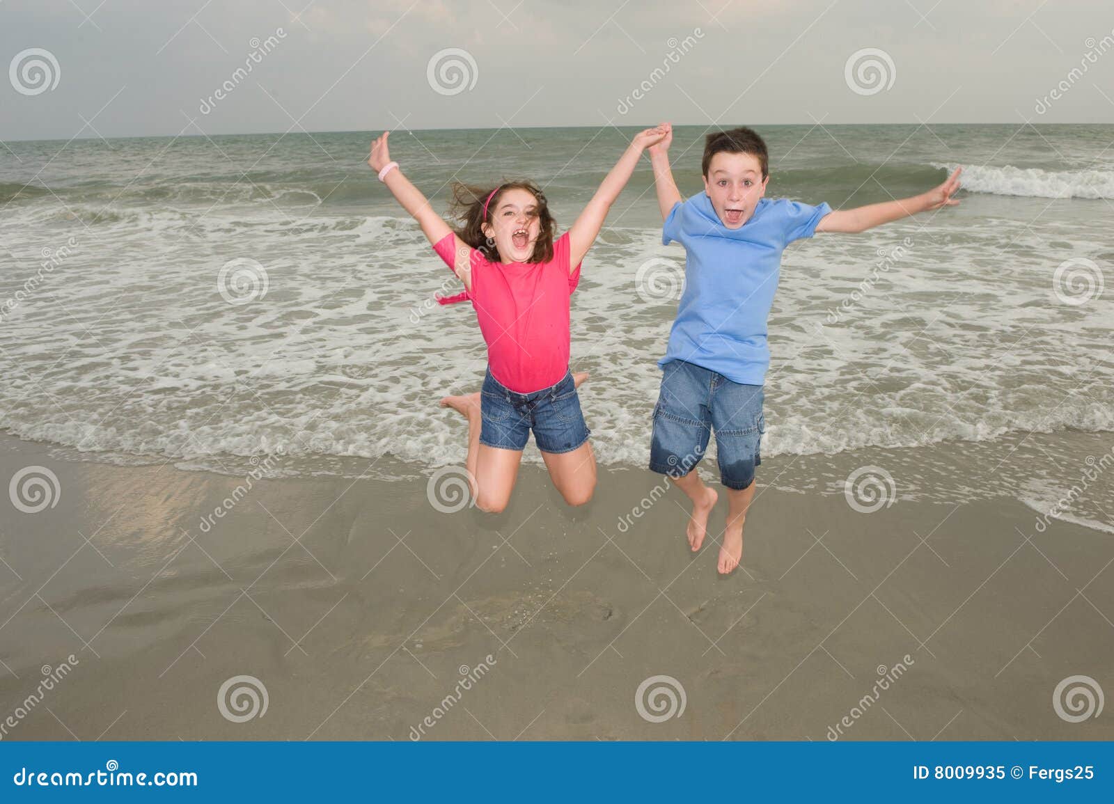 Kids stock image. Image of ecstatic, sand, brunette, shirt - 8009935