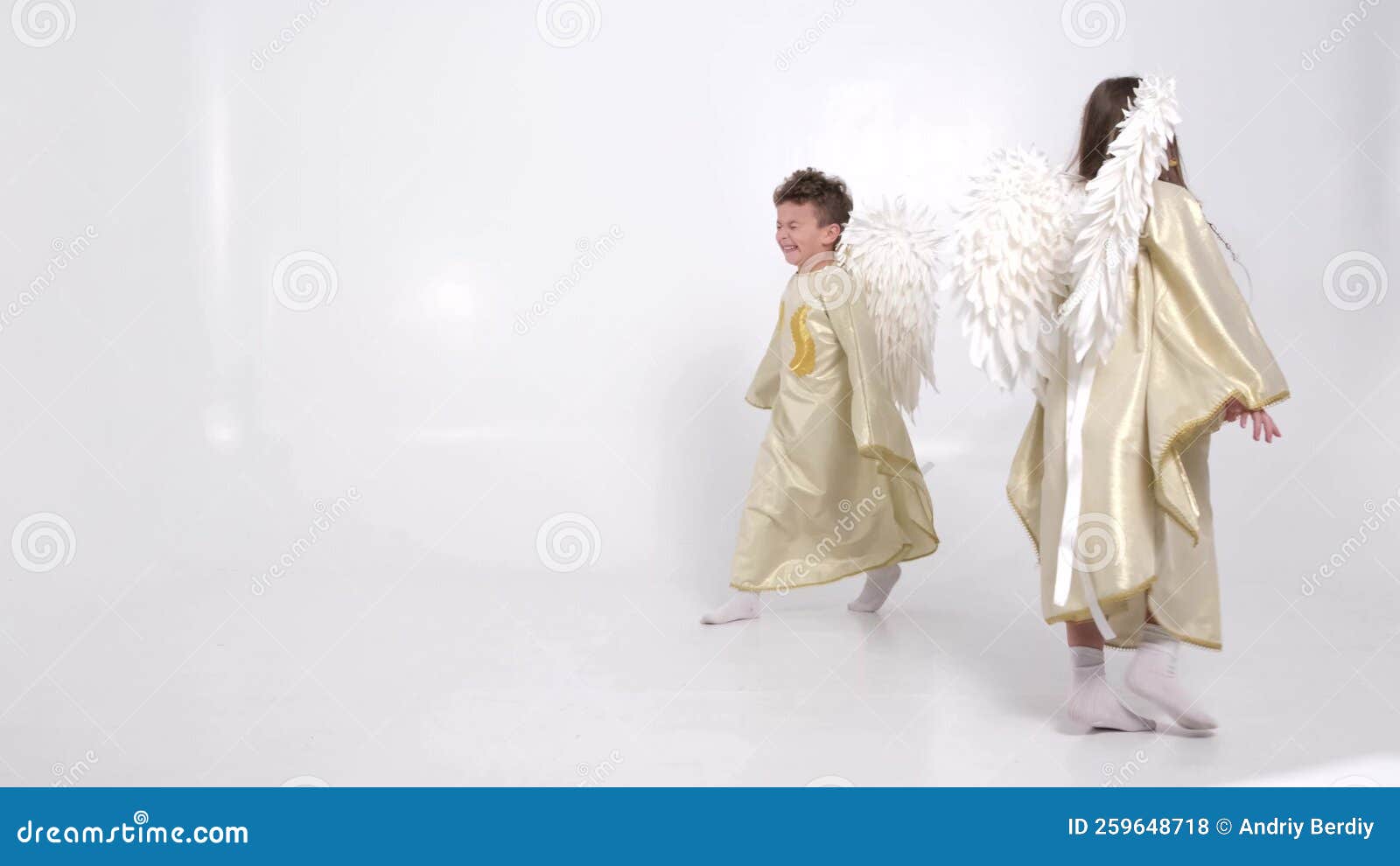 Kids Angels with White Wings are Playing in the Studio on a White ...