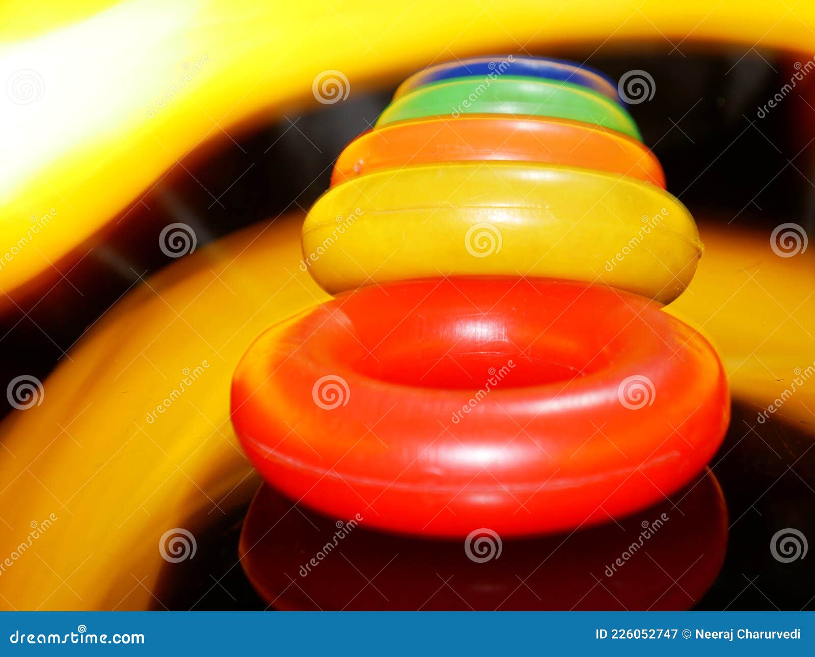 Arranging Plastic Toy Circular Blocks Presented with Yellowish Light ...